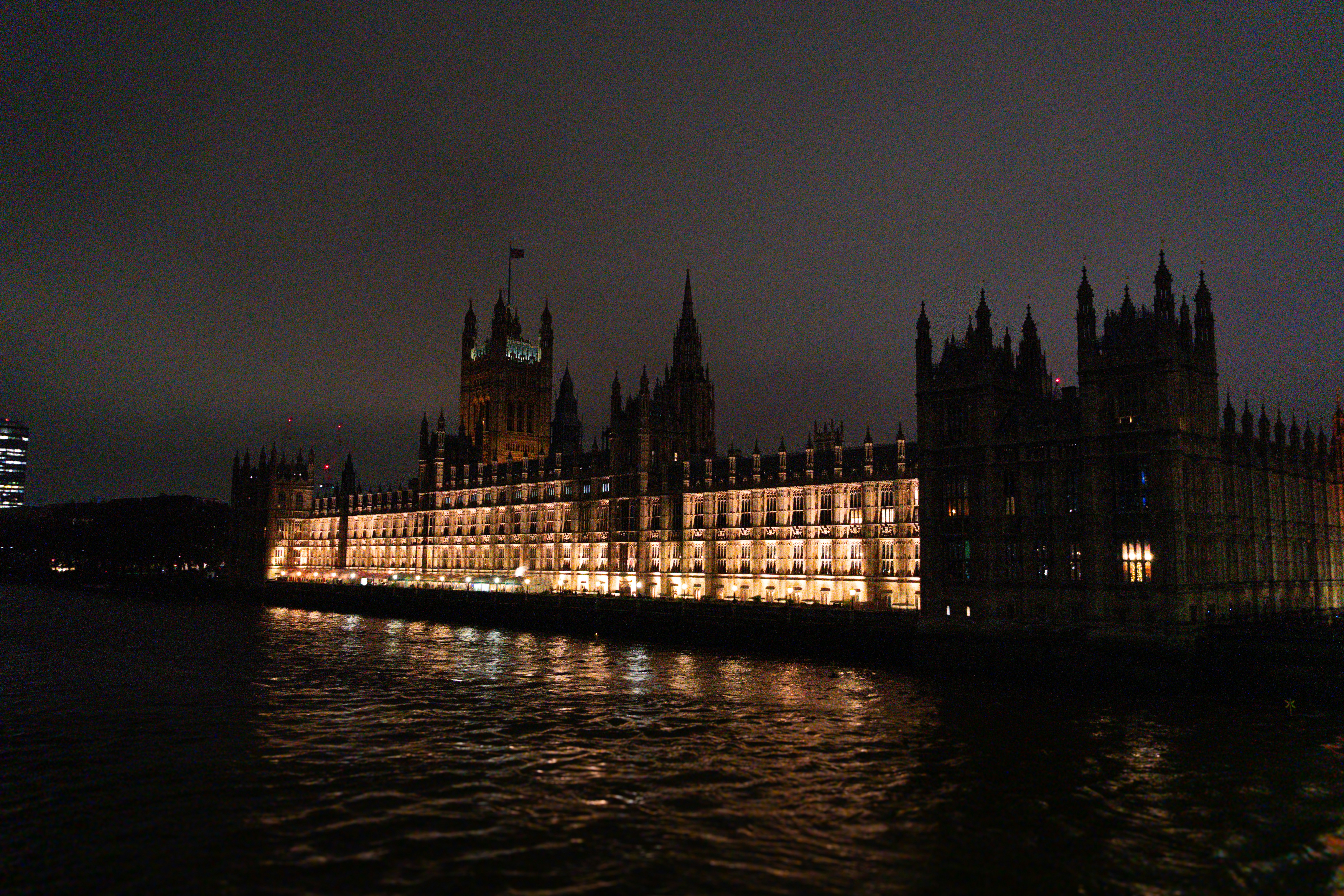 Luminous Riverfront: The Palace of Westminster at Night