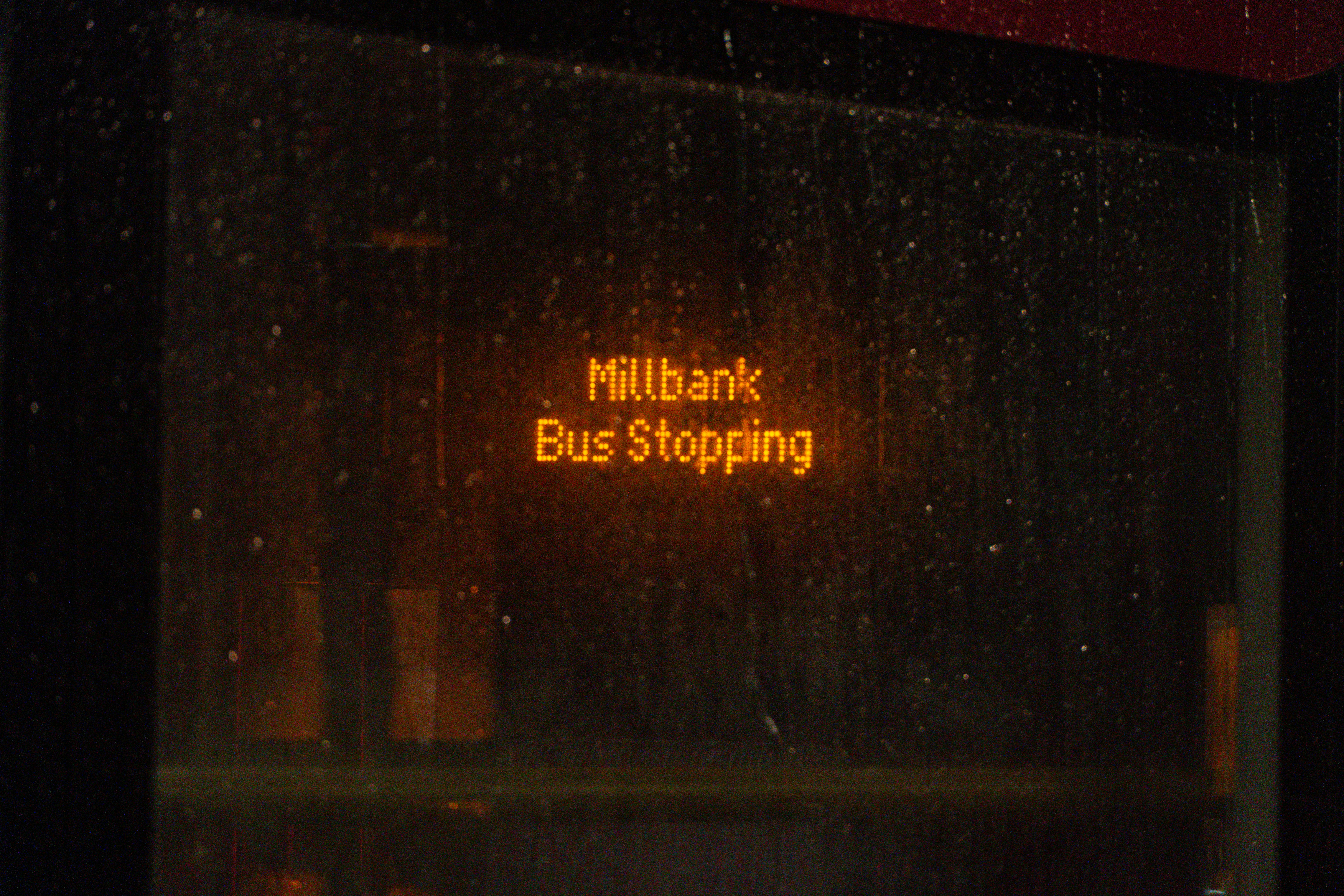Glowing Bus Stop: Neon Sign at Night
