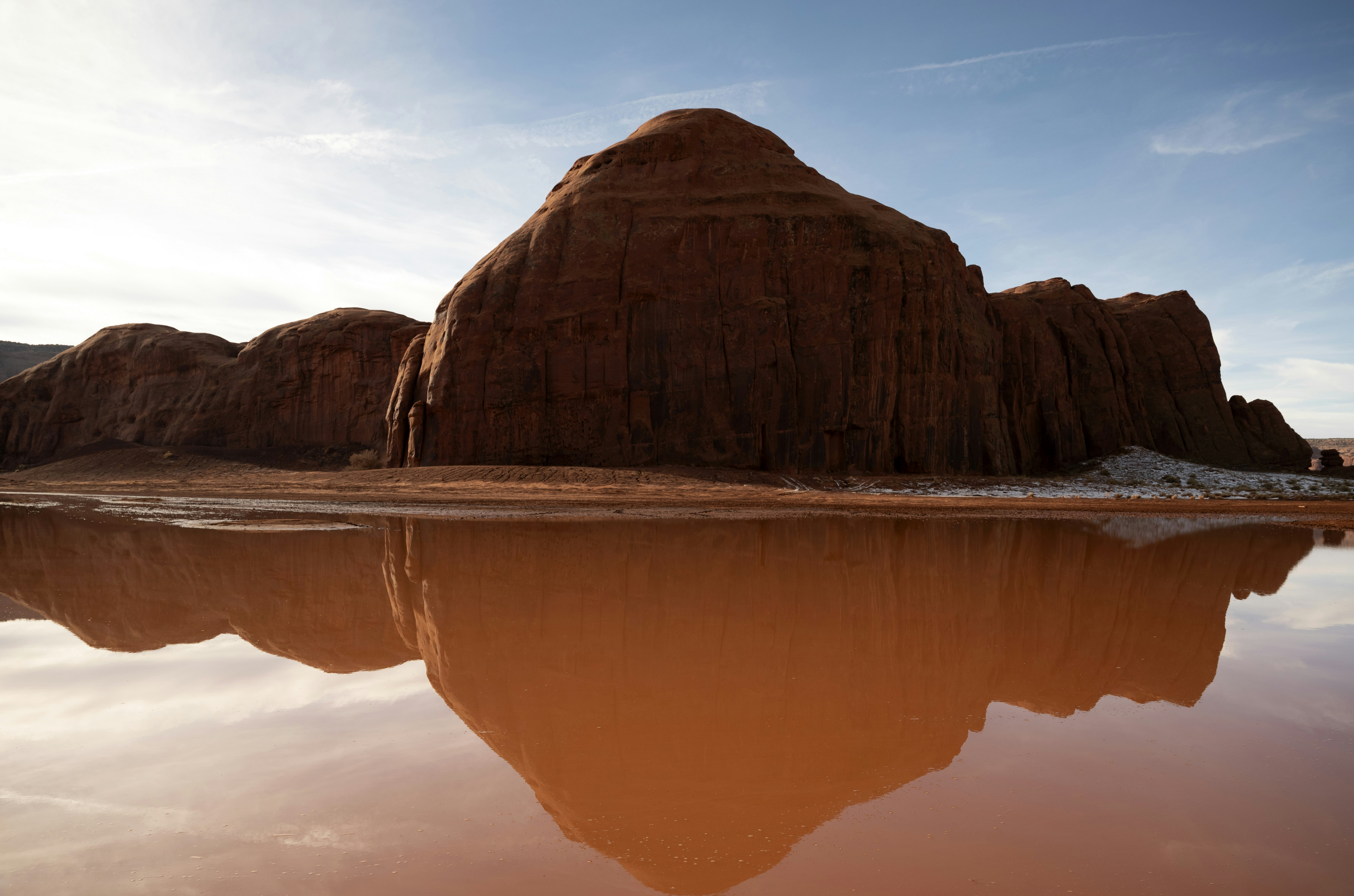 Red Rock Sentinel Framed by a Silence-Mmooth Tide