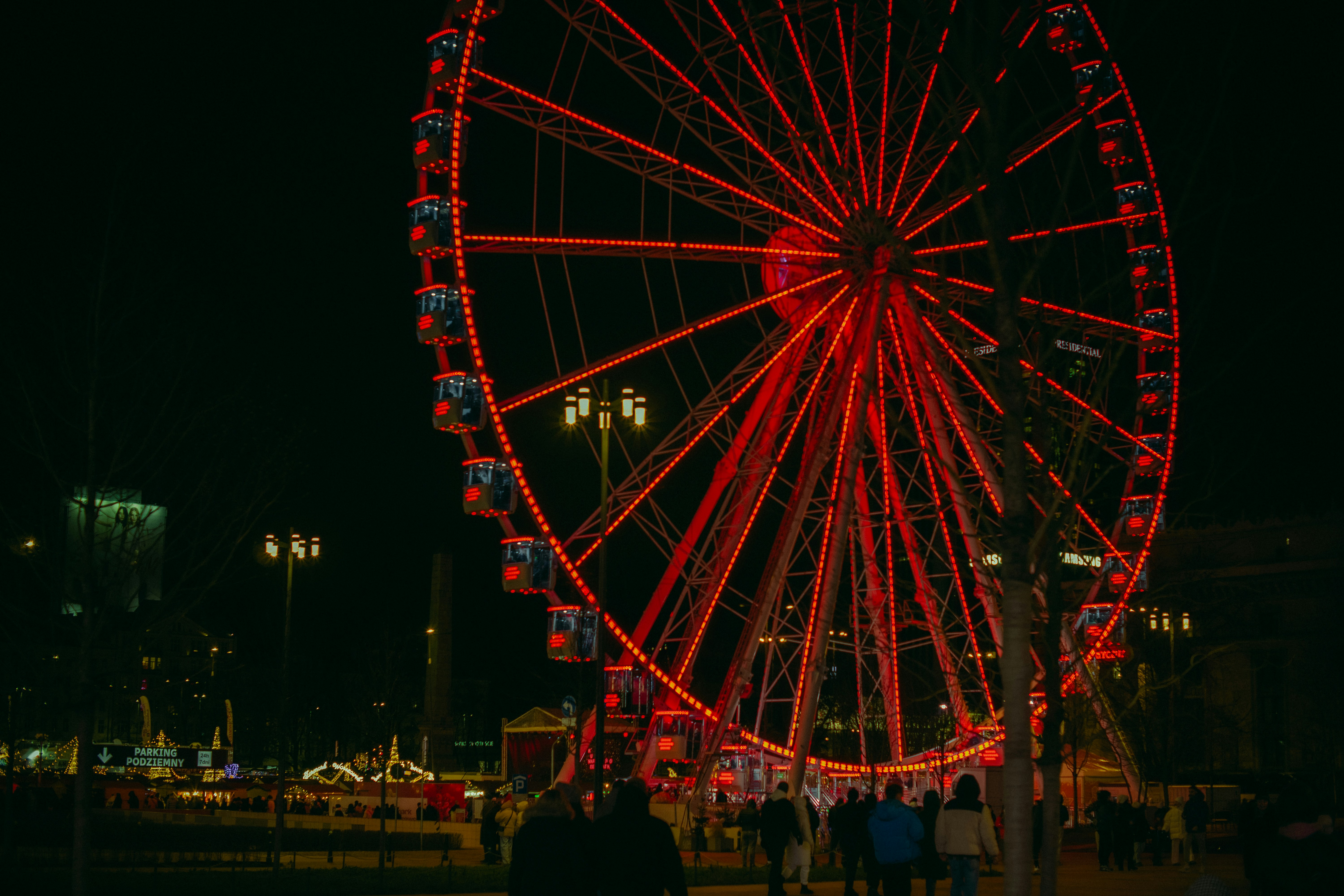 Red Wheel of Night: A Neon Carousel Tower.