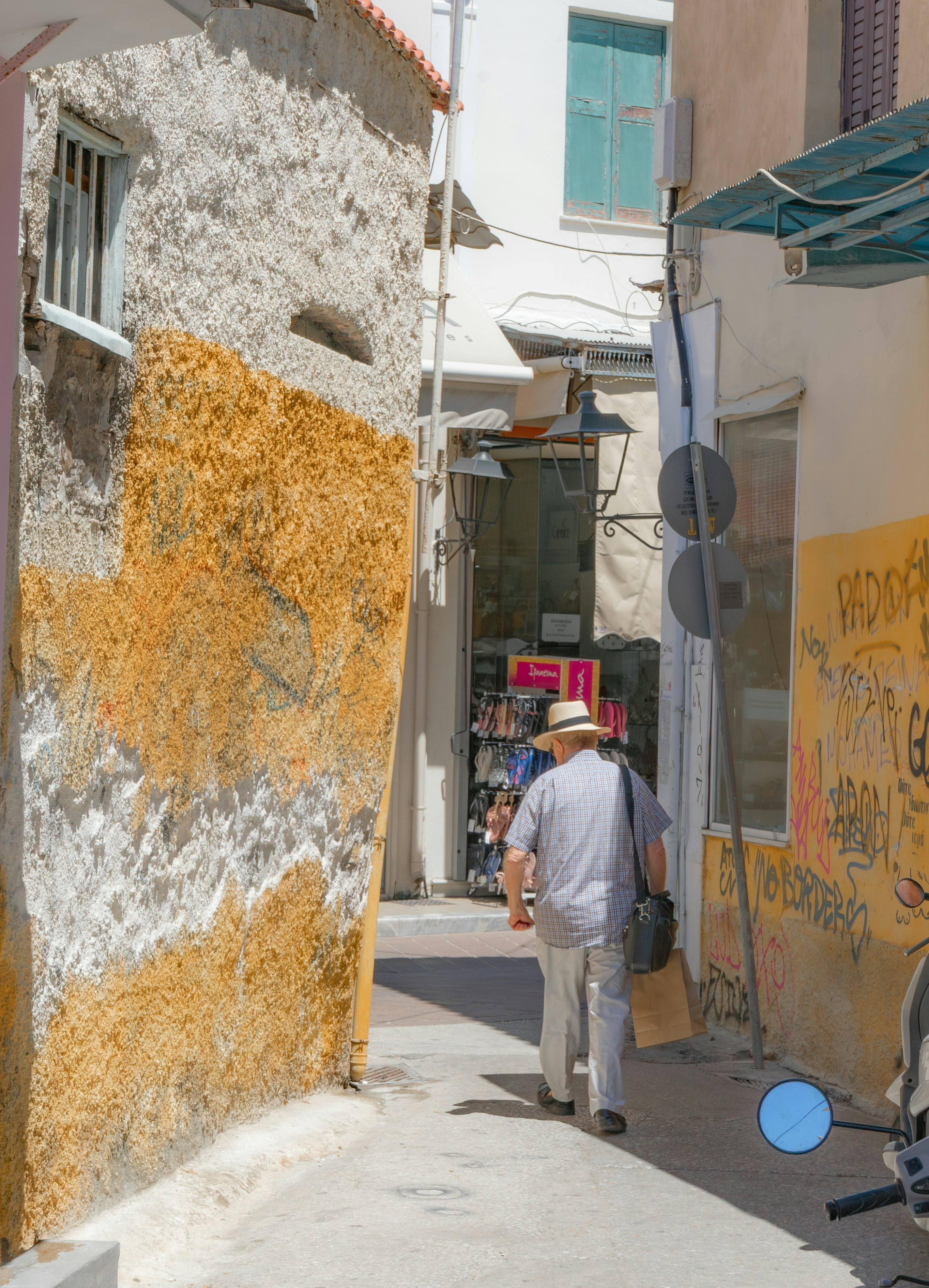 A Quiet Alley: The Wanderer Beneath a Sunlit Arch