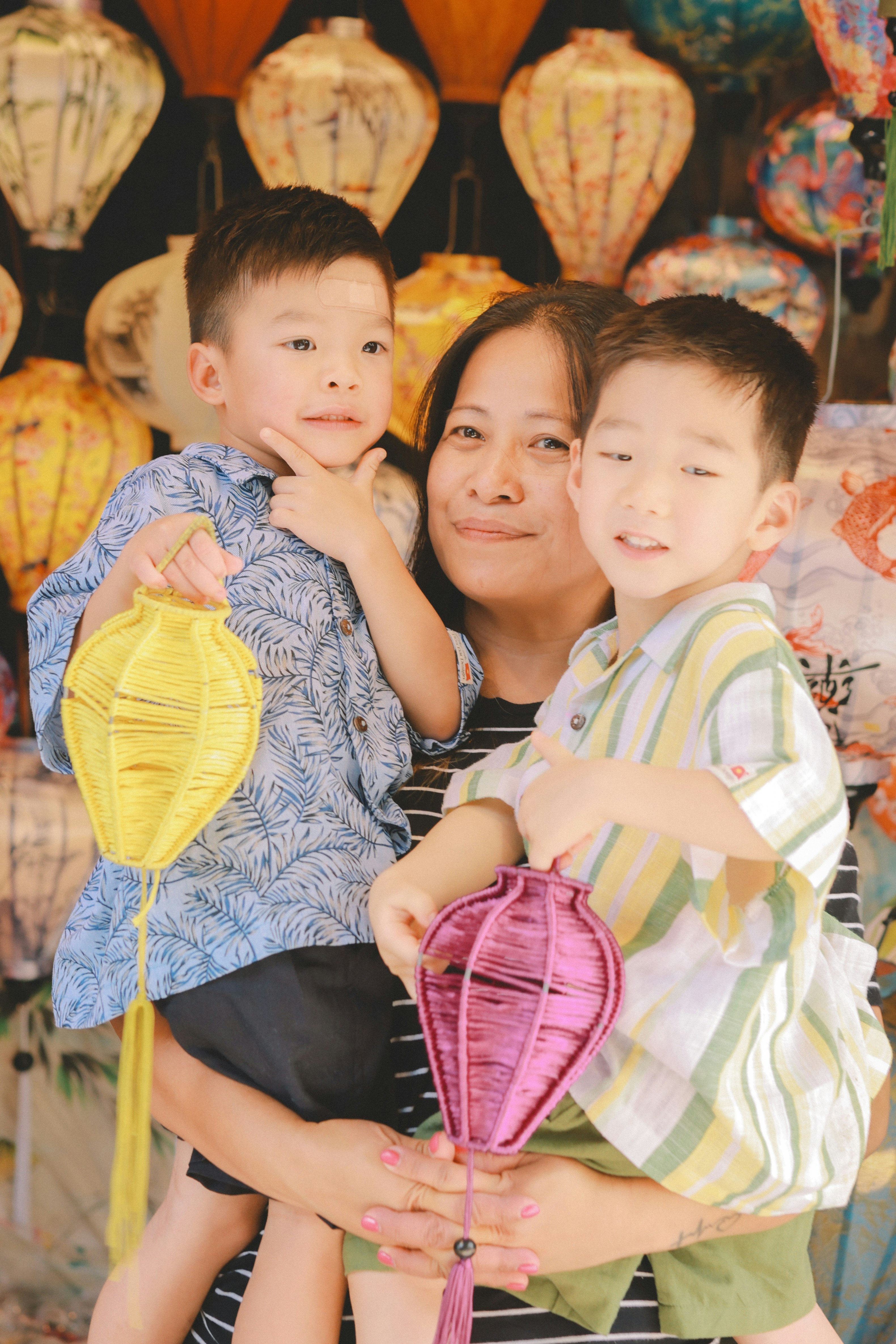 Lanterns, Love, and Laughter: A Mother’s Embrace Under Festive Skies