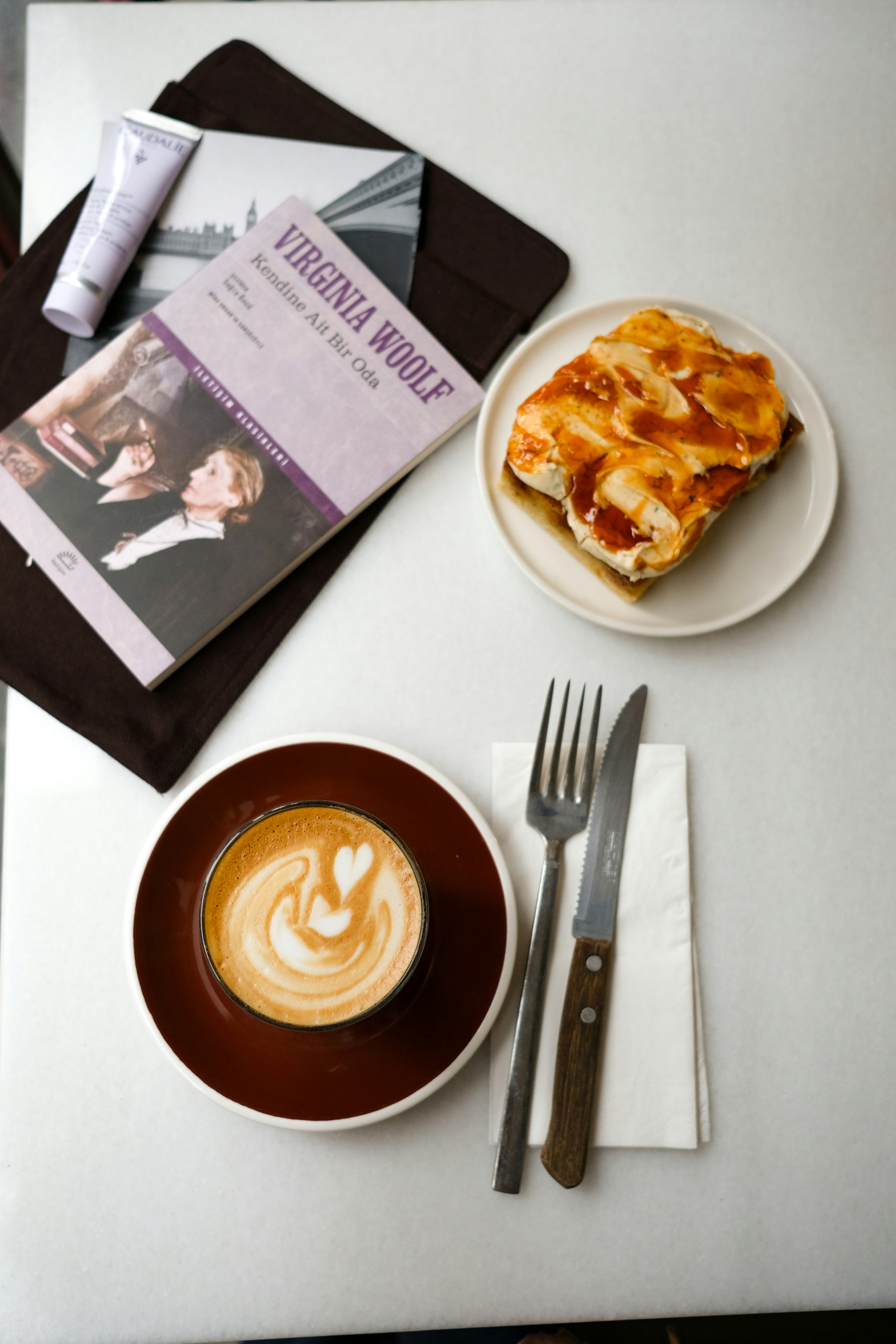 Cafe Table Serenade: latte art, pastry, and a book-lined moment