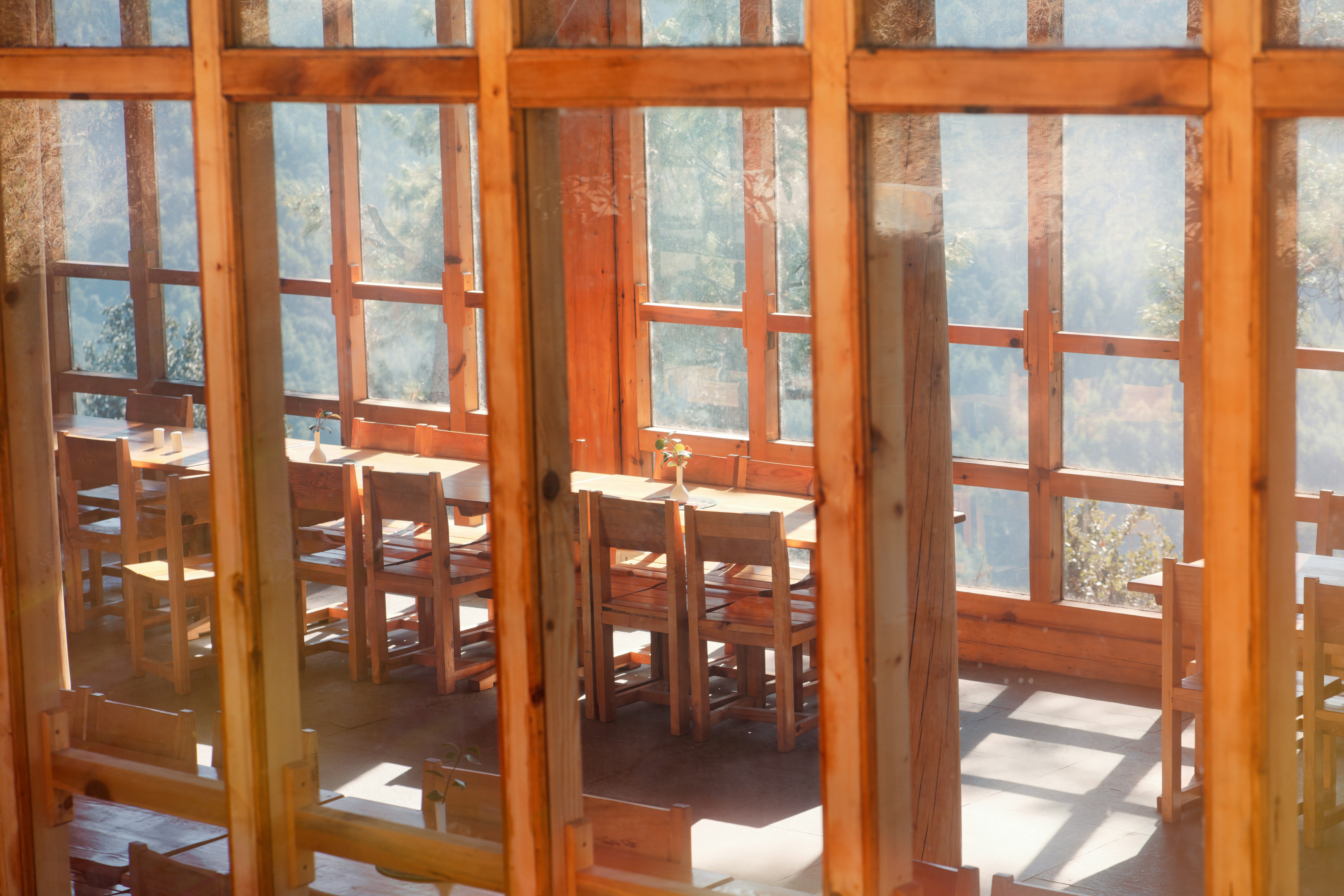 Sunlit Dining Corridor Through Wooden Lattices