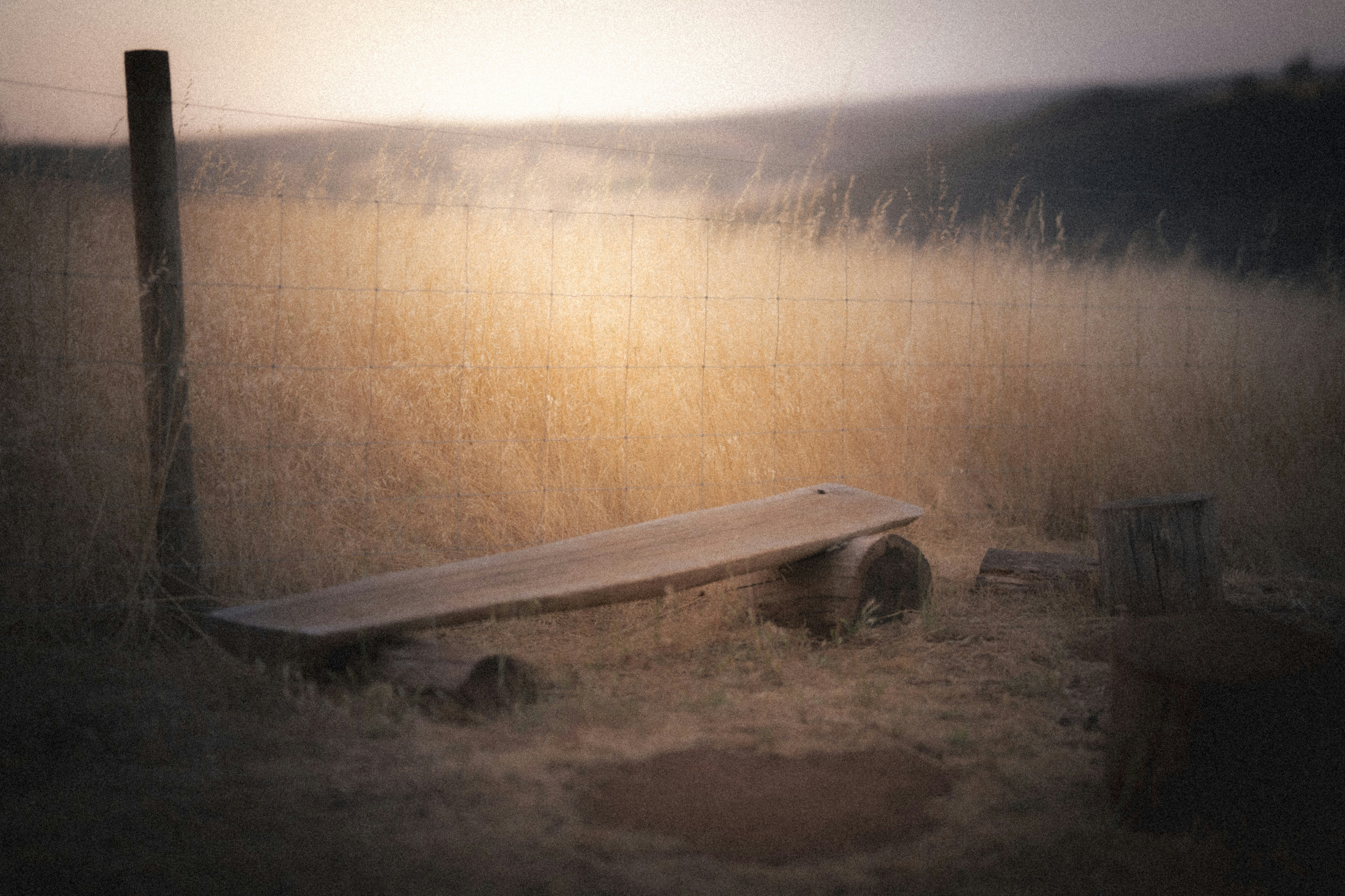 Dusty Playground: A Rusted Wheelbarrow in Golden Evening