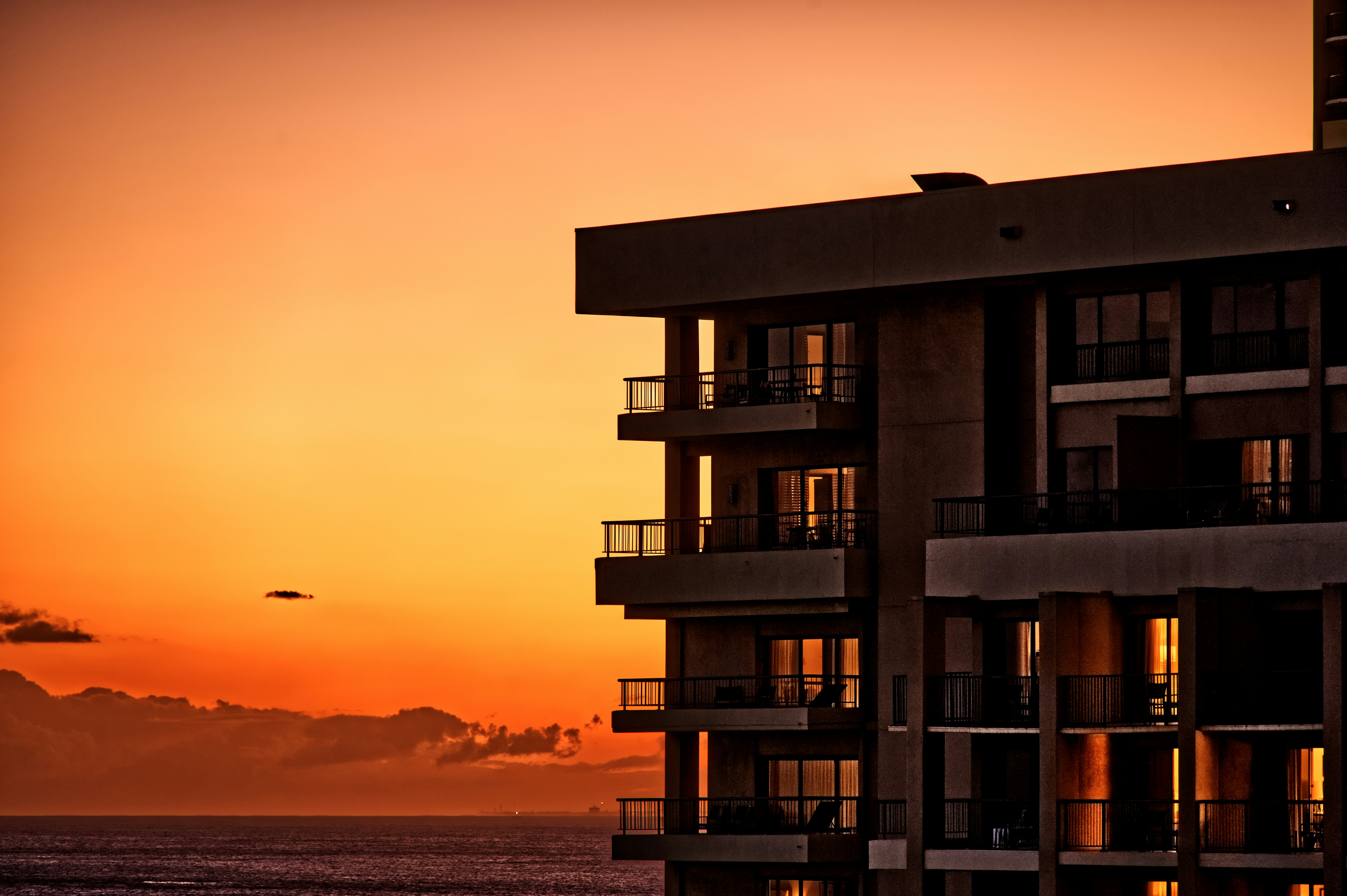 Tropical sunset overlooking building