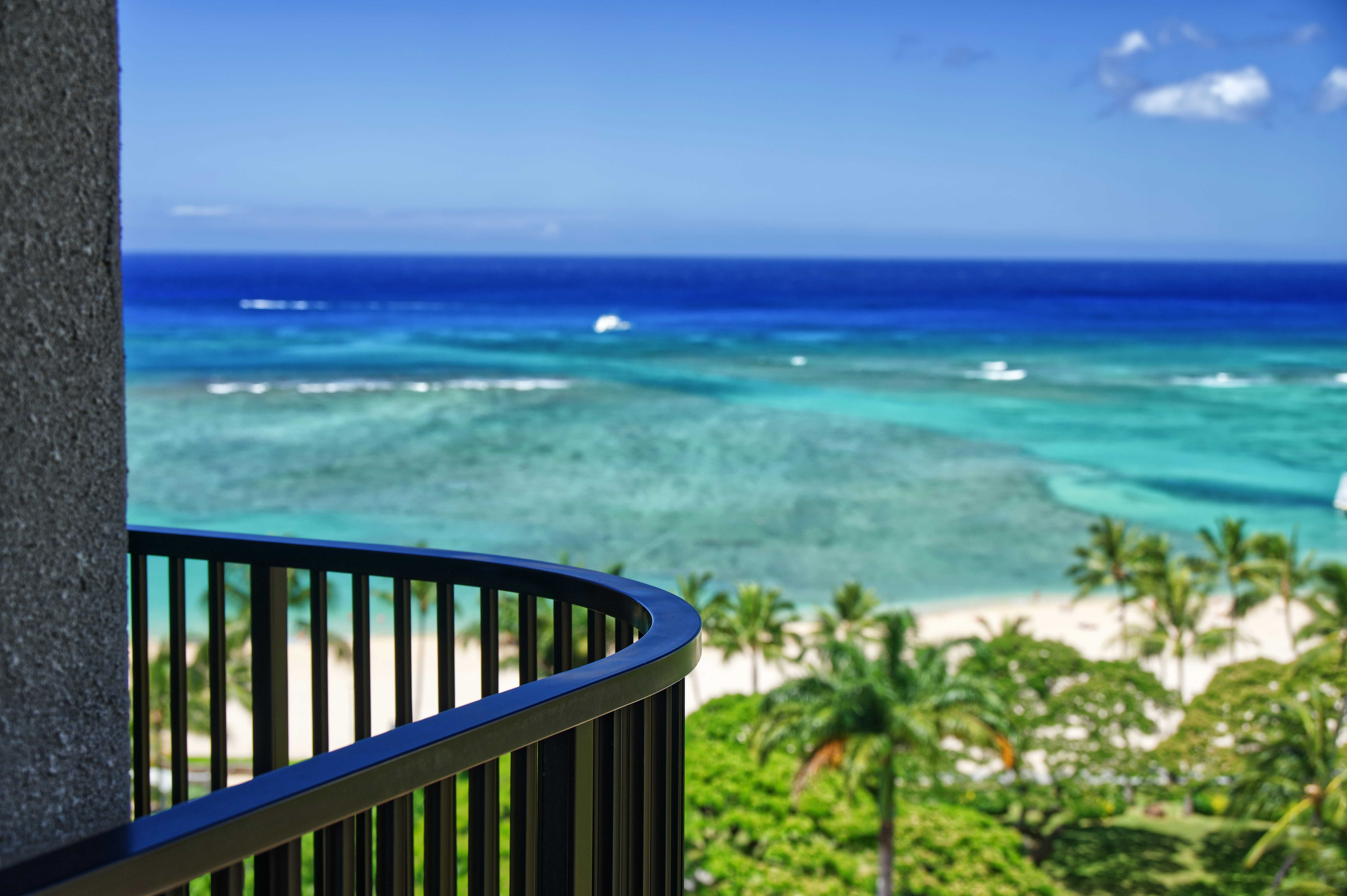 Balcony Overlooking Turquoise Seas from a Tropical Resort
