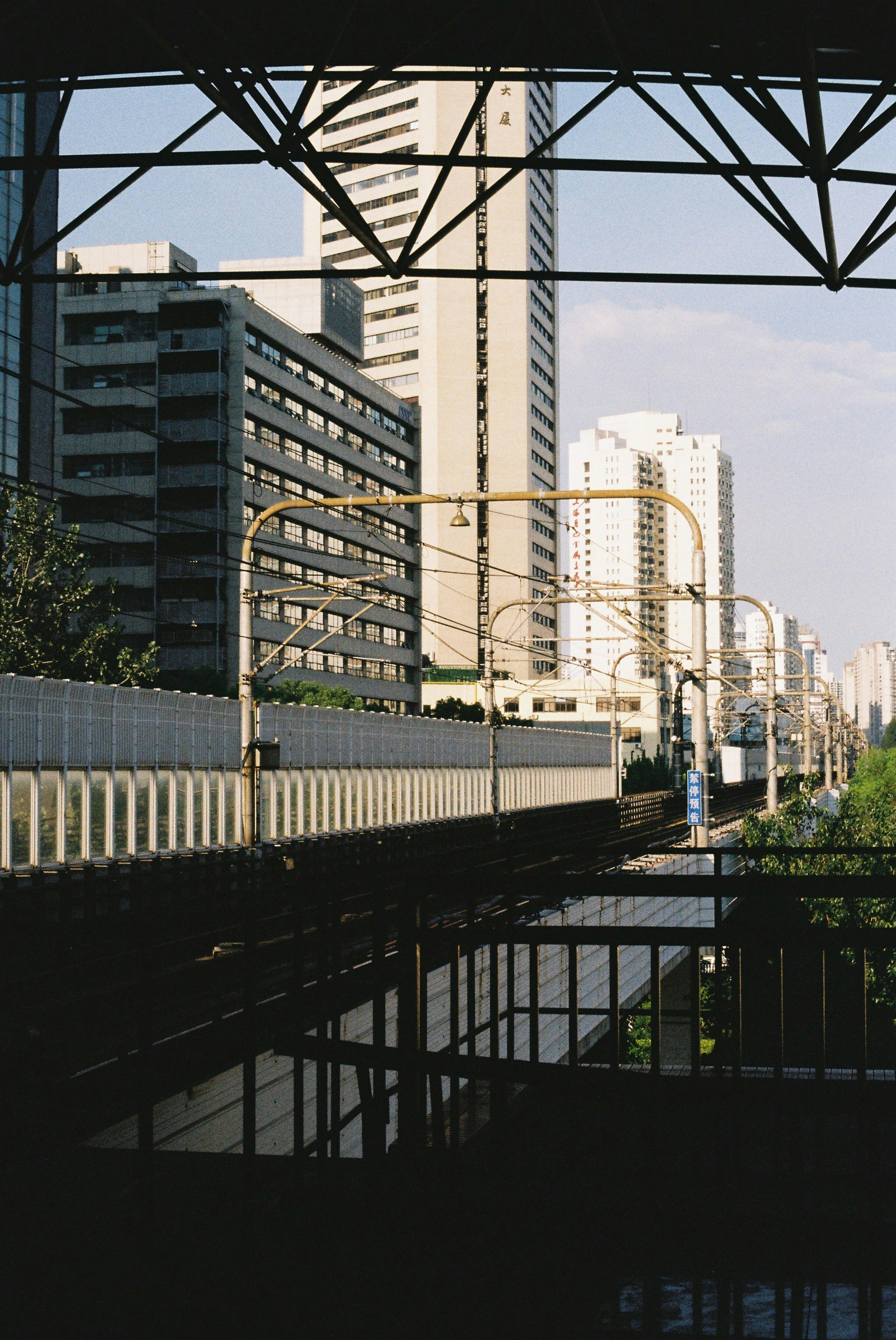 City buildings and train tracks under a clear sky. photo – Free ...