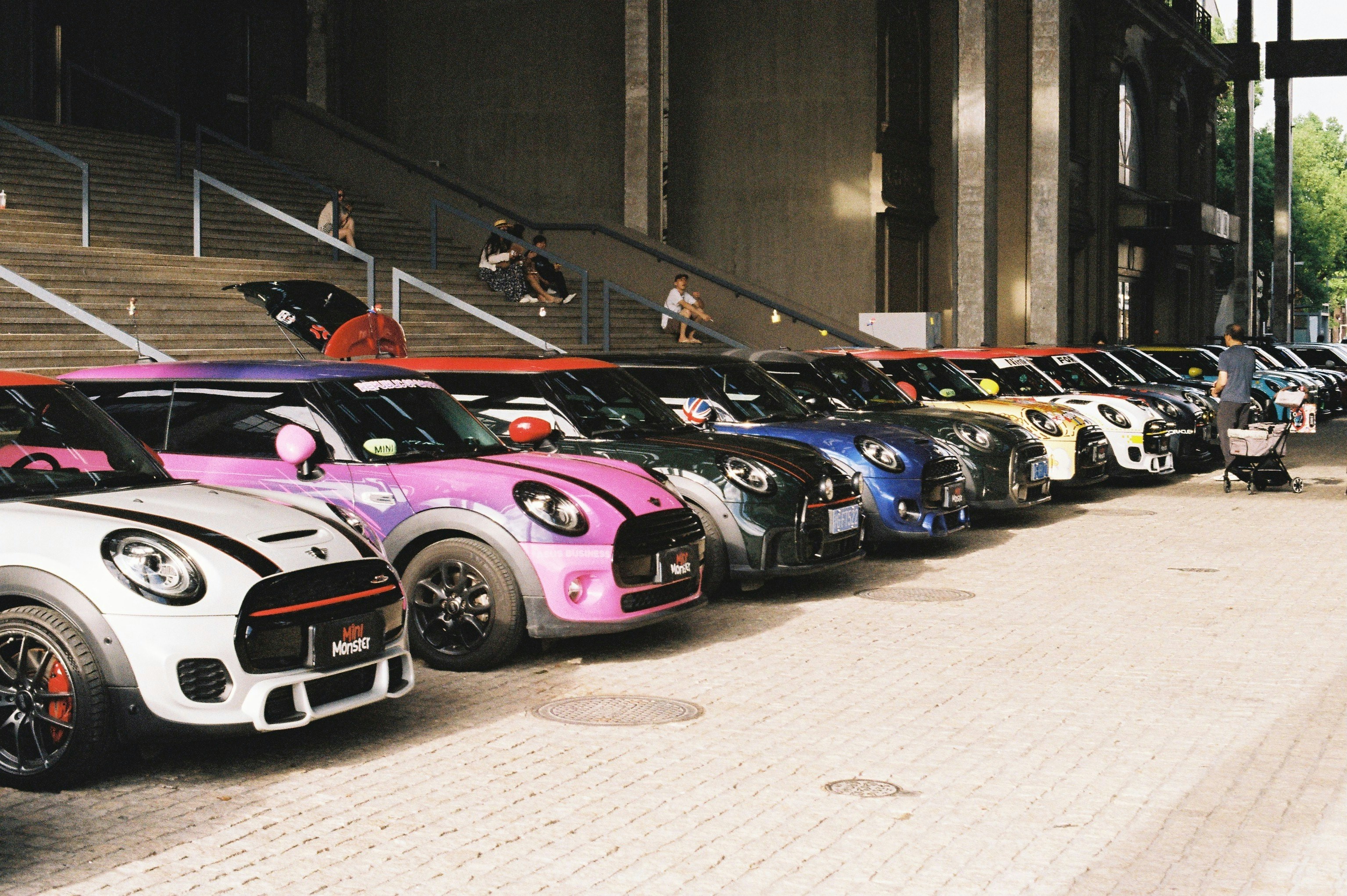 Lineup of colorful minis under a concrete canopy