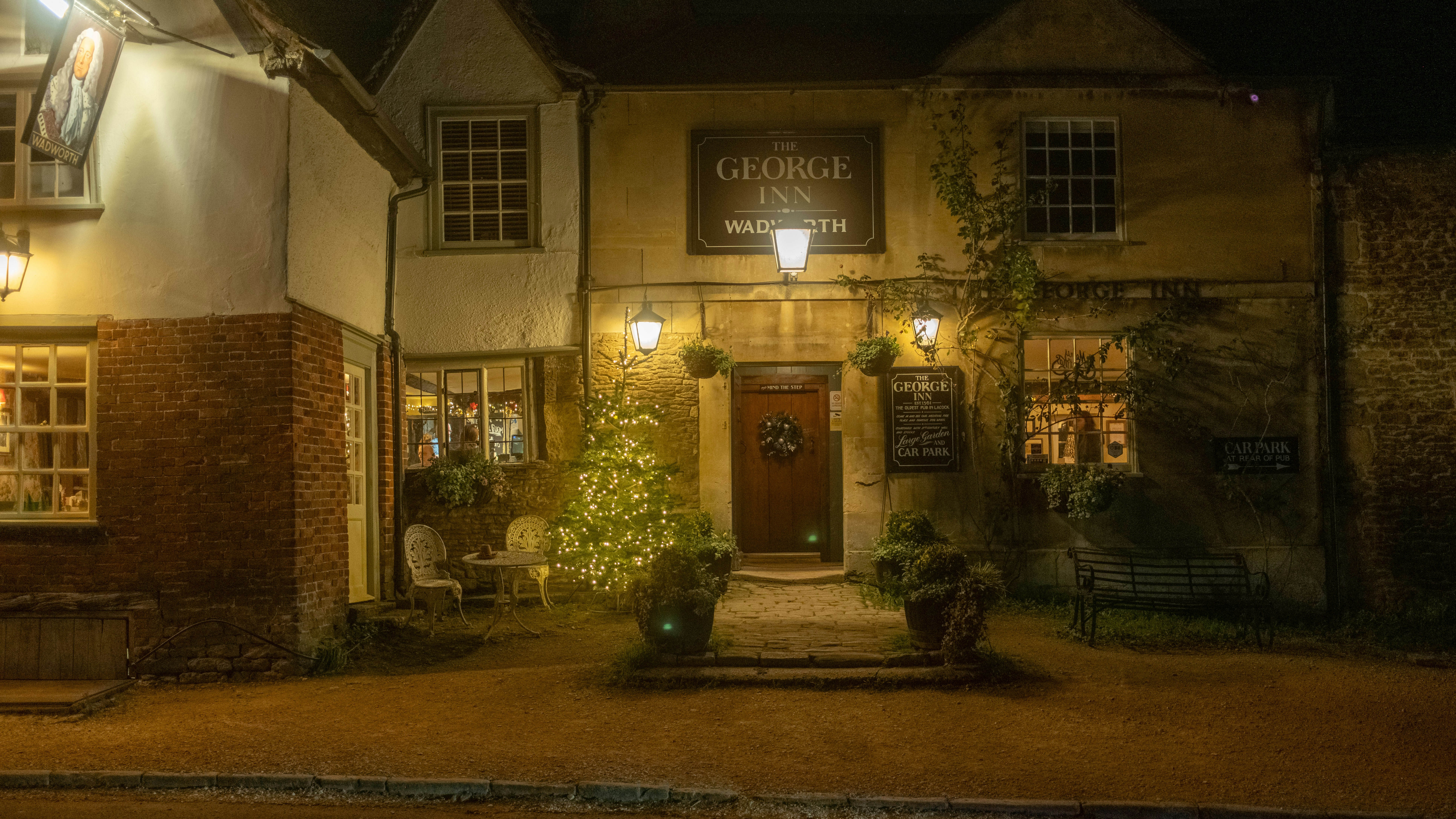 Tavern entrance at night with christmas tree photo – Free Christmas ...