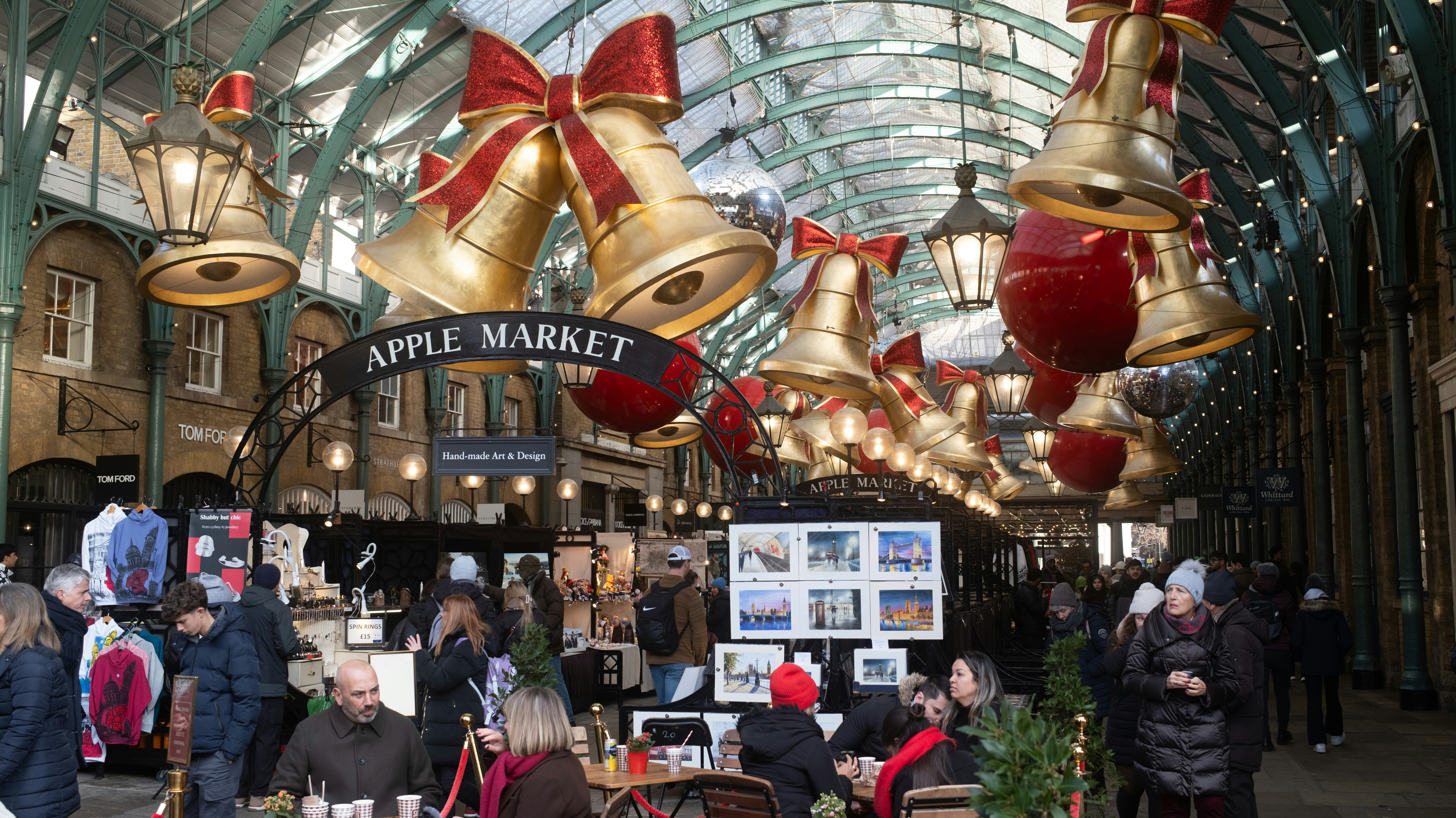 Holiday Market Confluence Under a Ceiling of Bells