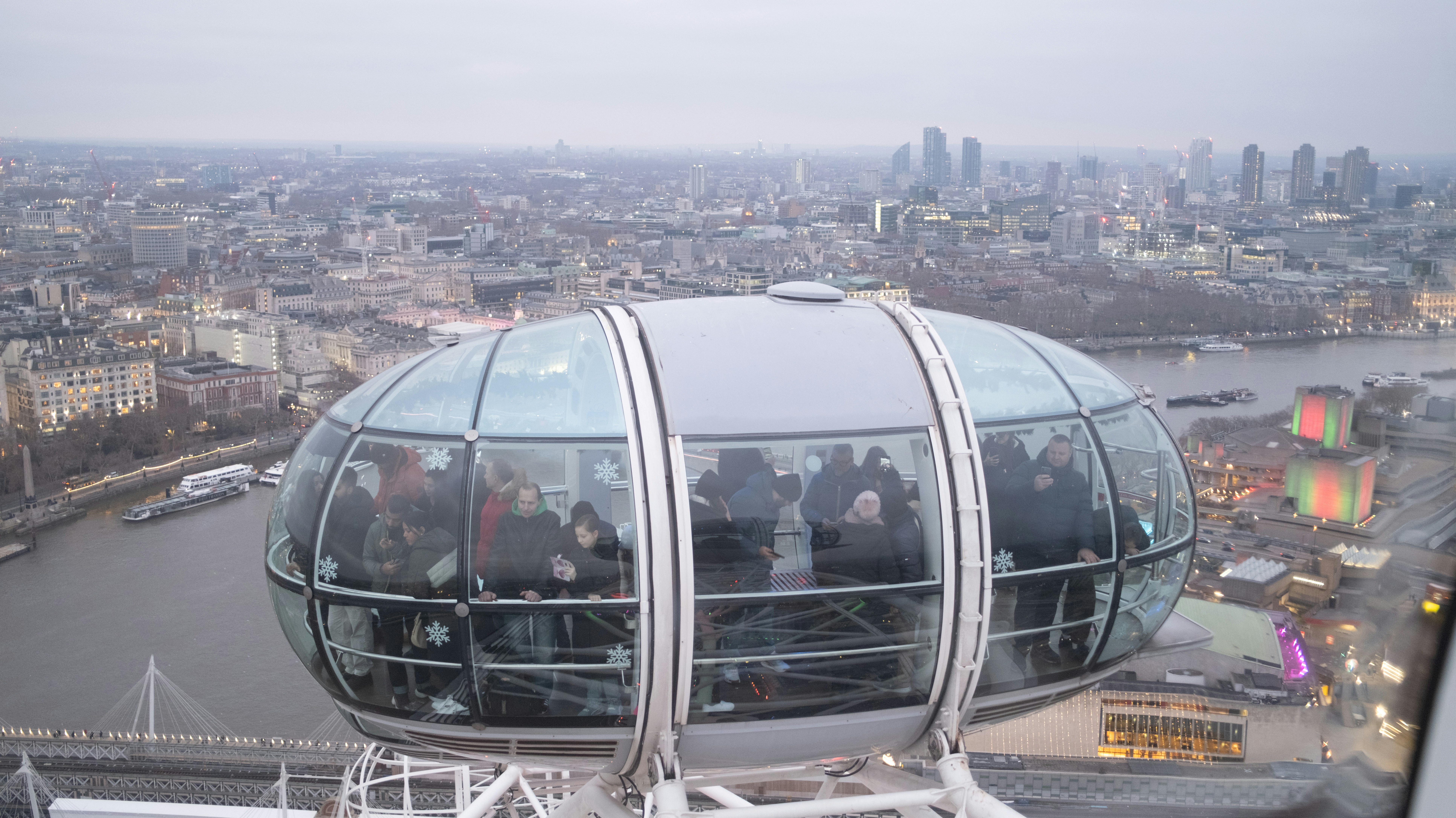 Globe Atrium Overlook: Passengers Inside a Futuristic Glass Capsule Above the River