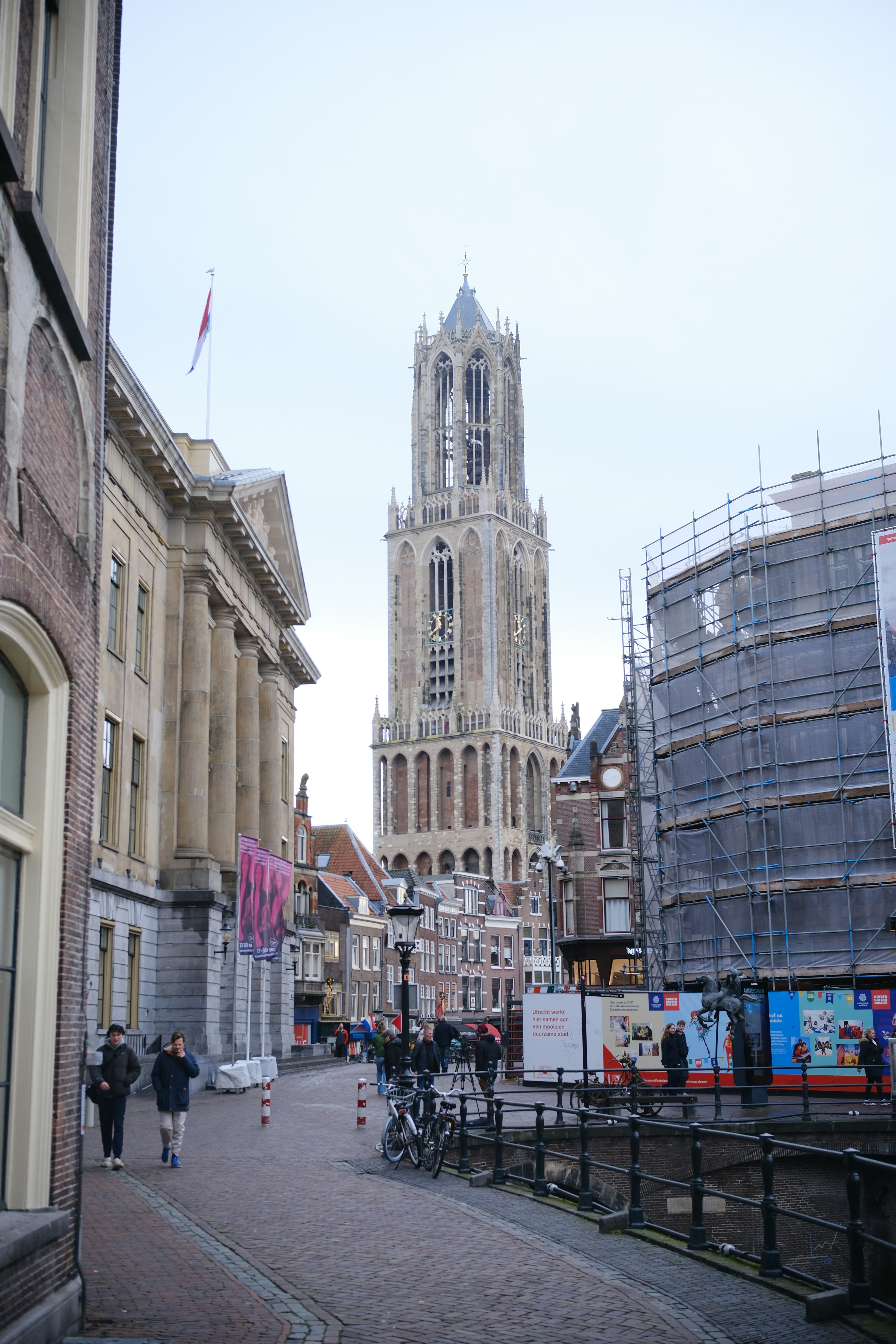 Towering Gothic Decline: A Dutch City Street with a Spire Rising
