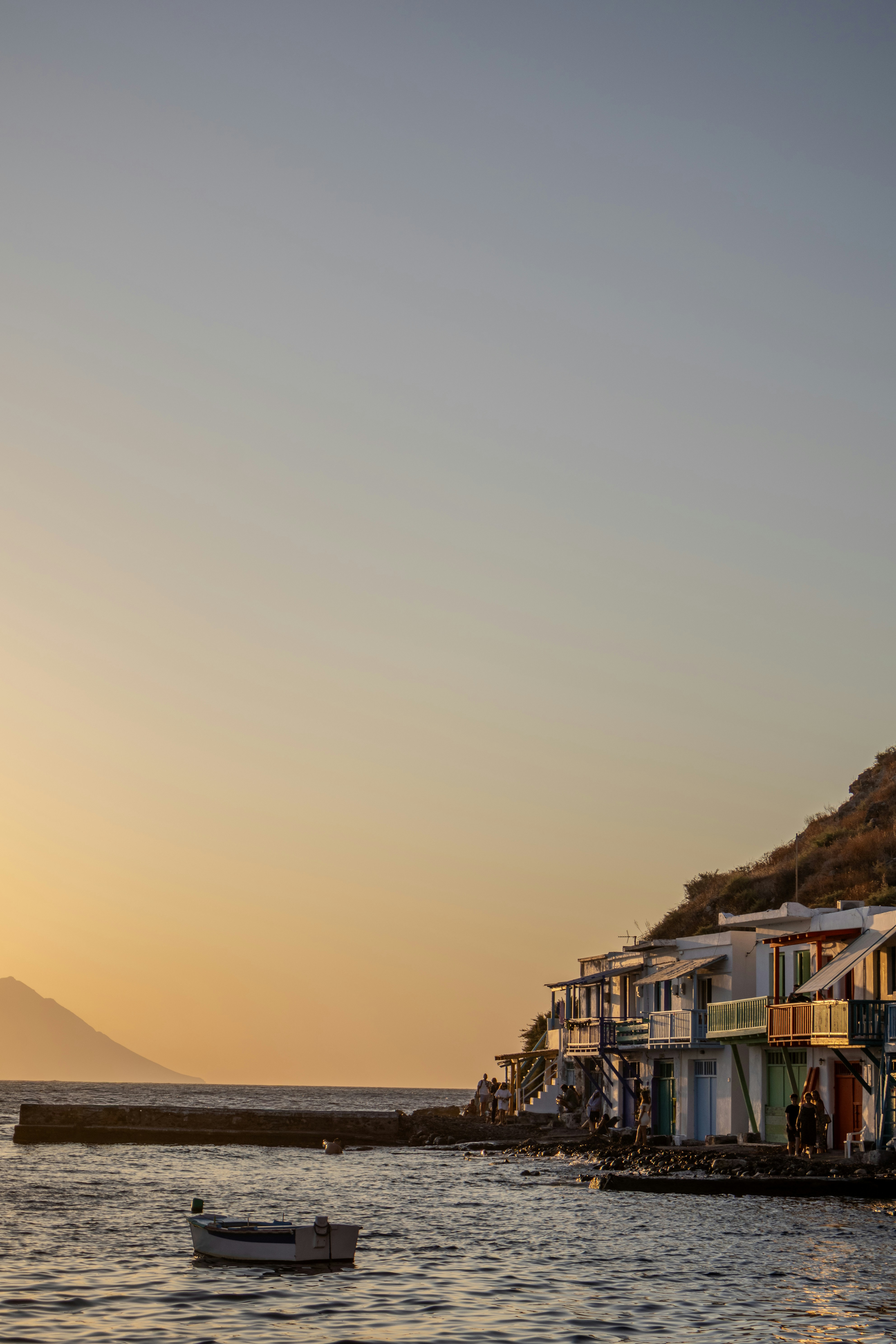 Sunlit Shoreline Dwellings at Dusk