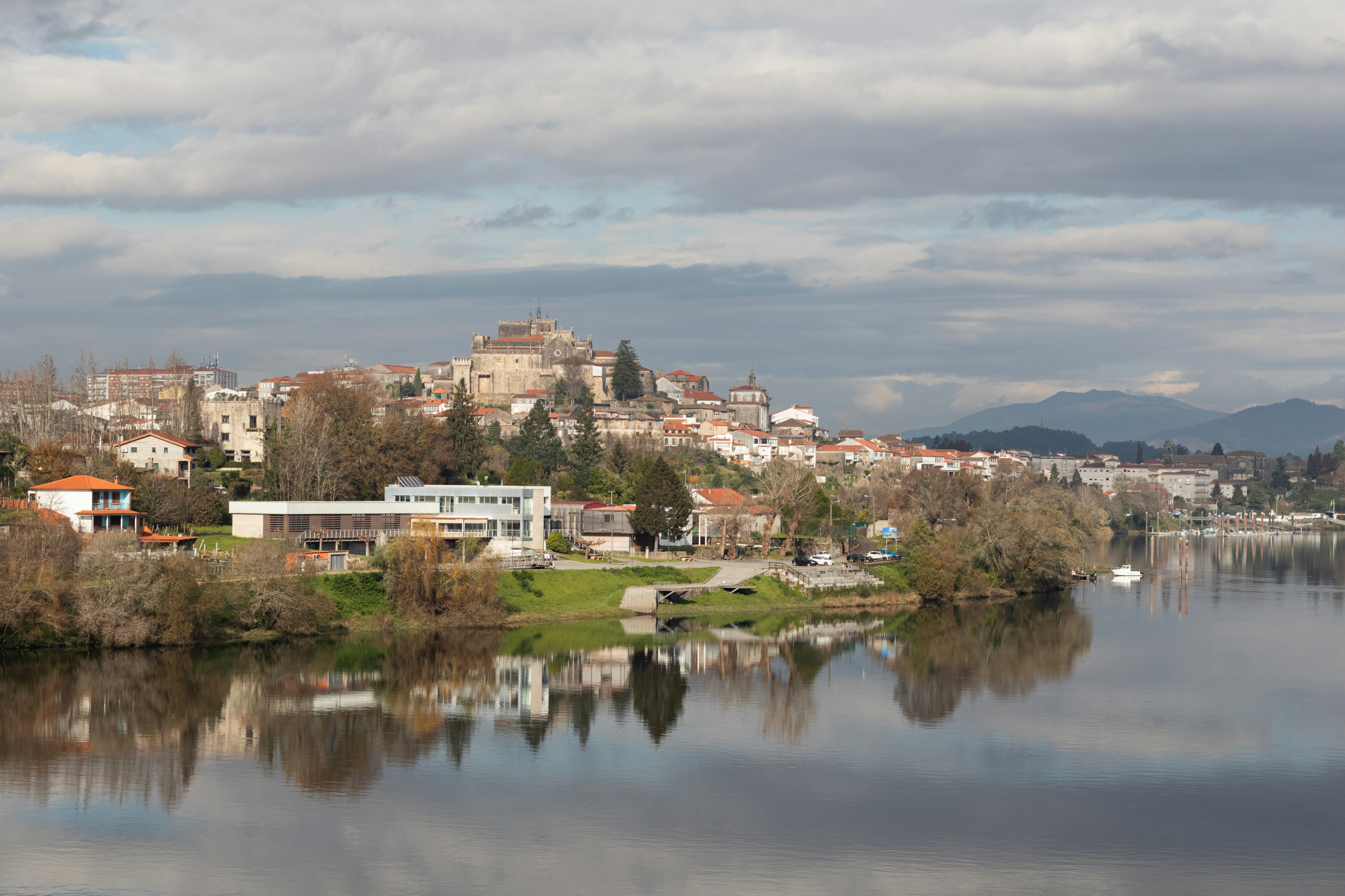 Lakeside Town with Hilltop Fortess: Reflections on a Quiet Morning