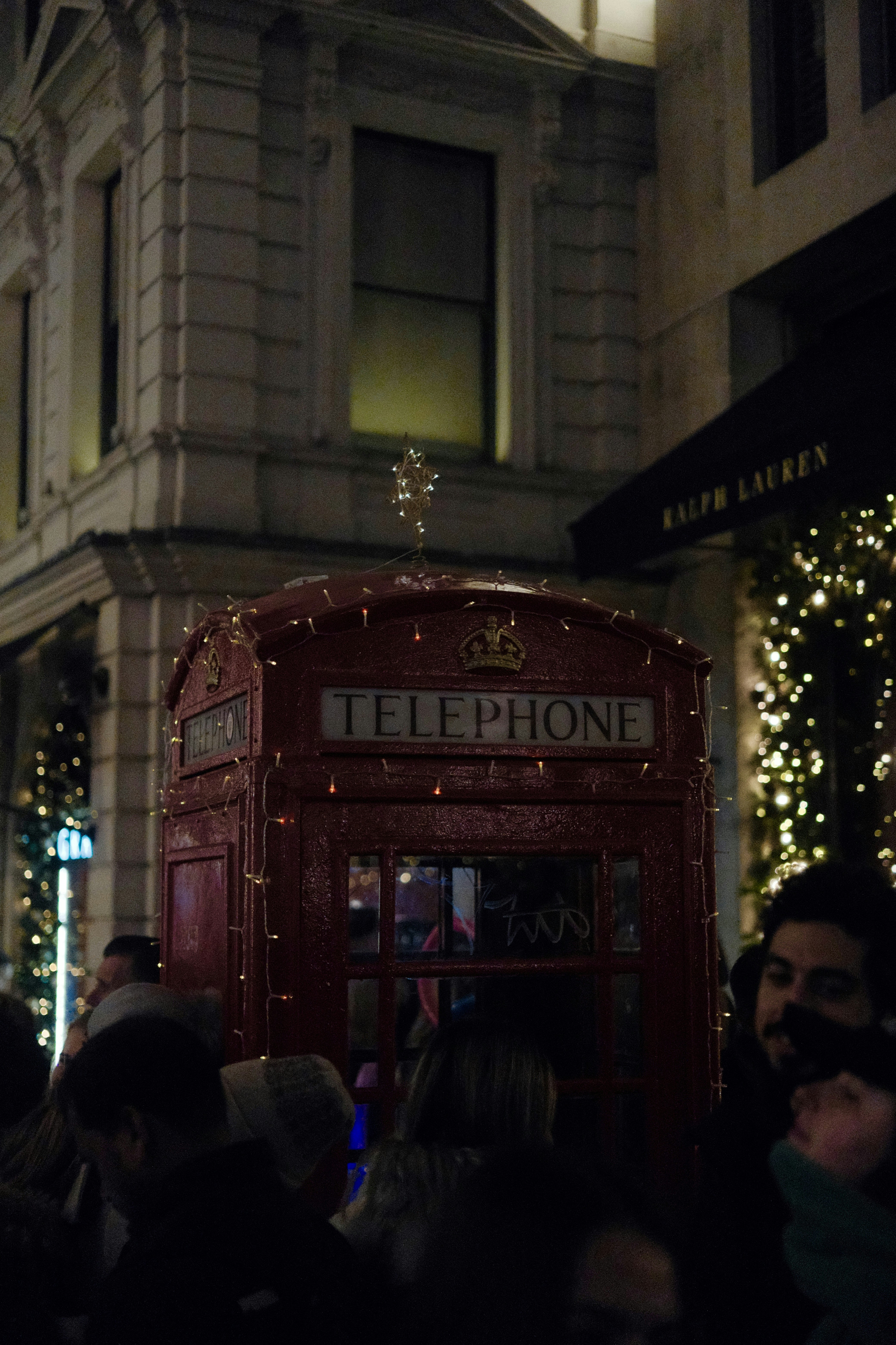London Night: A Red Telephone Box Framed by City Lights