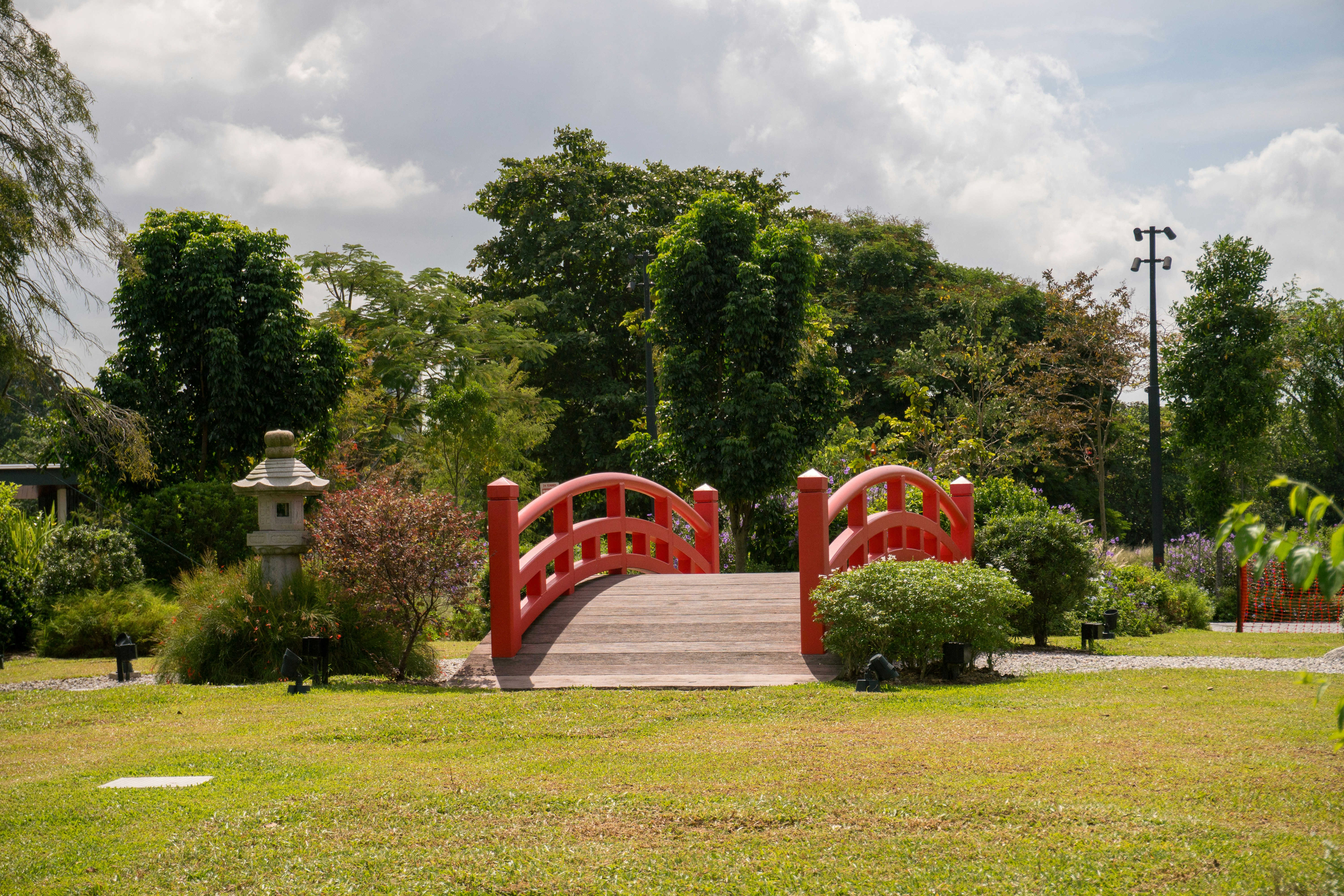 Red Arched Bridge in a Tranquil Park