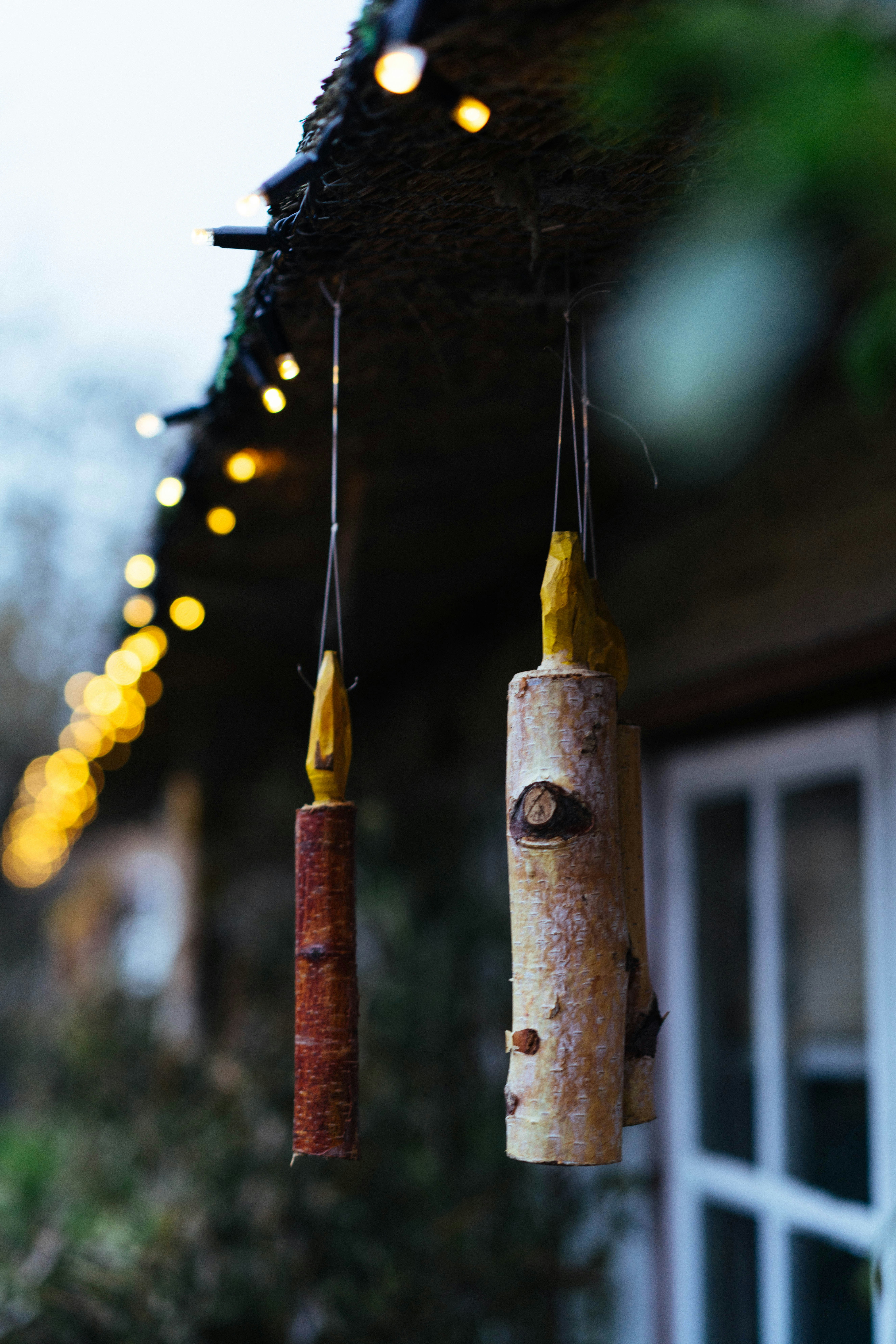 Hanging Candle-Tips in a Dusk-Lit Yard
