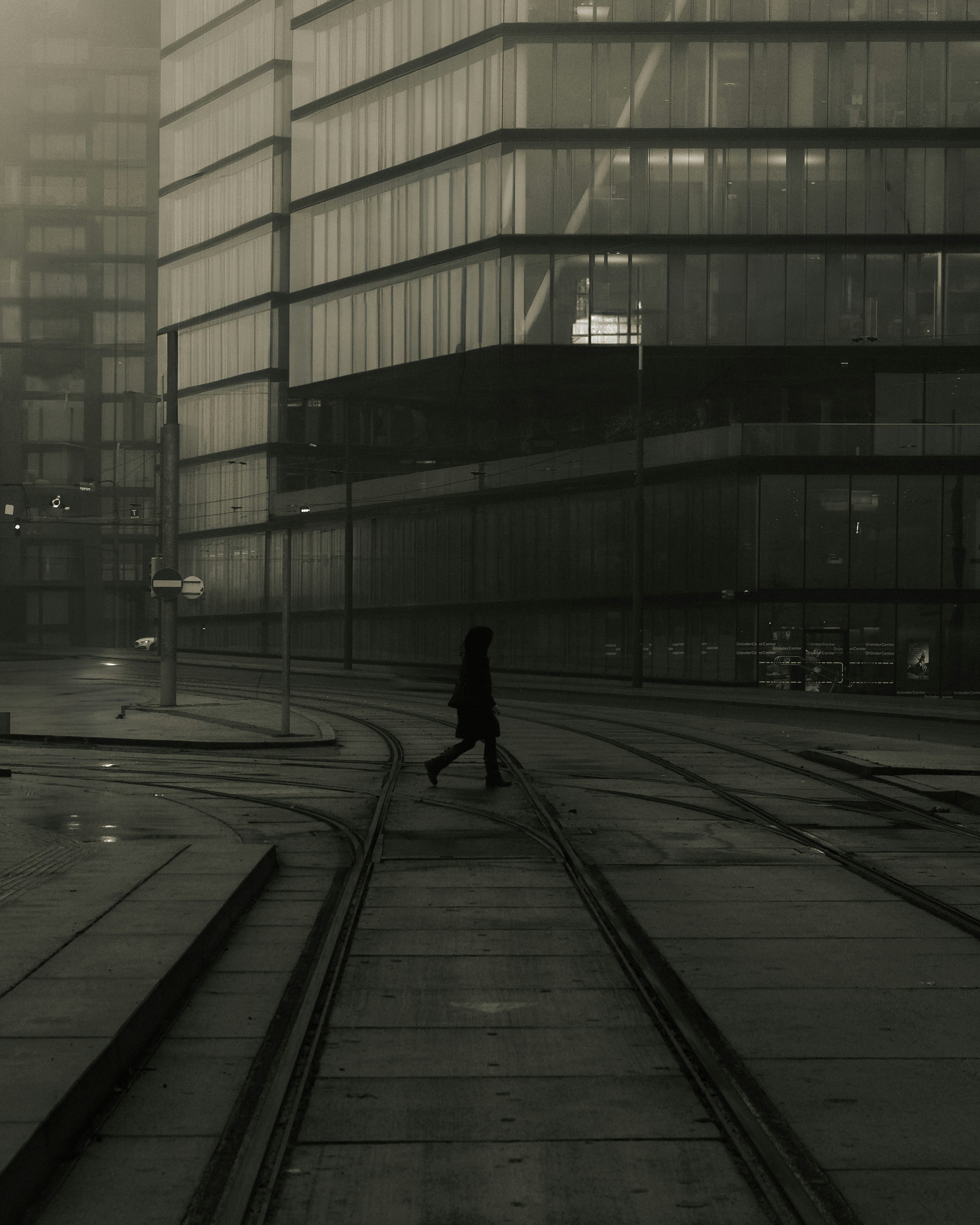Footstep of Silence: A Lone Figure Crossing City Rails