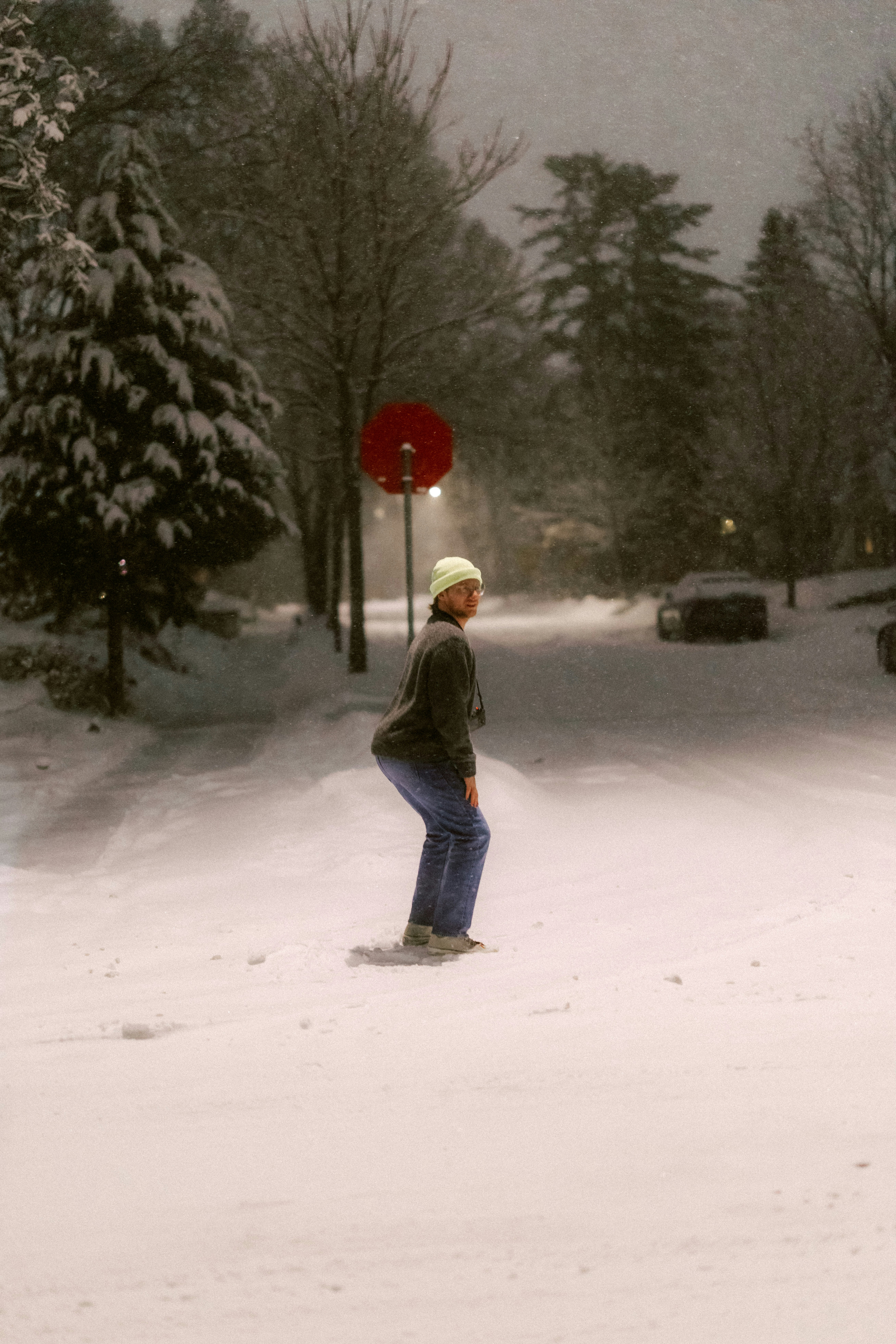 Snowbound Stance: A Quiet Moment in Winter Street