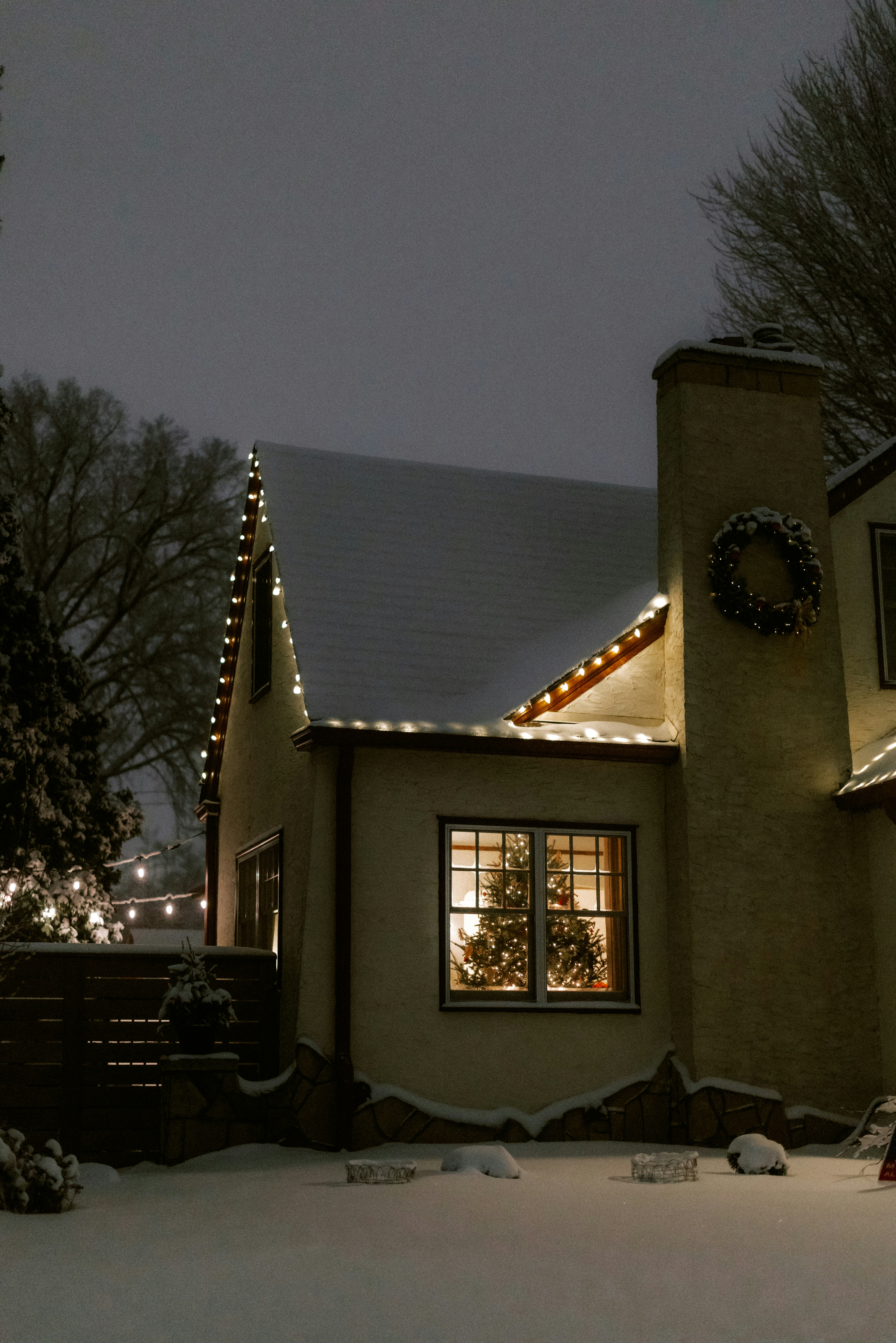 Snow-covered house decorated for christmas at night photo – Free ...