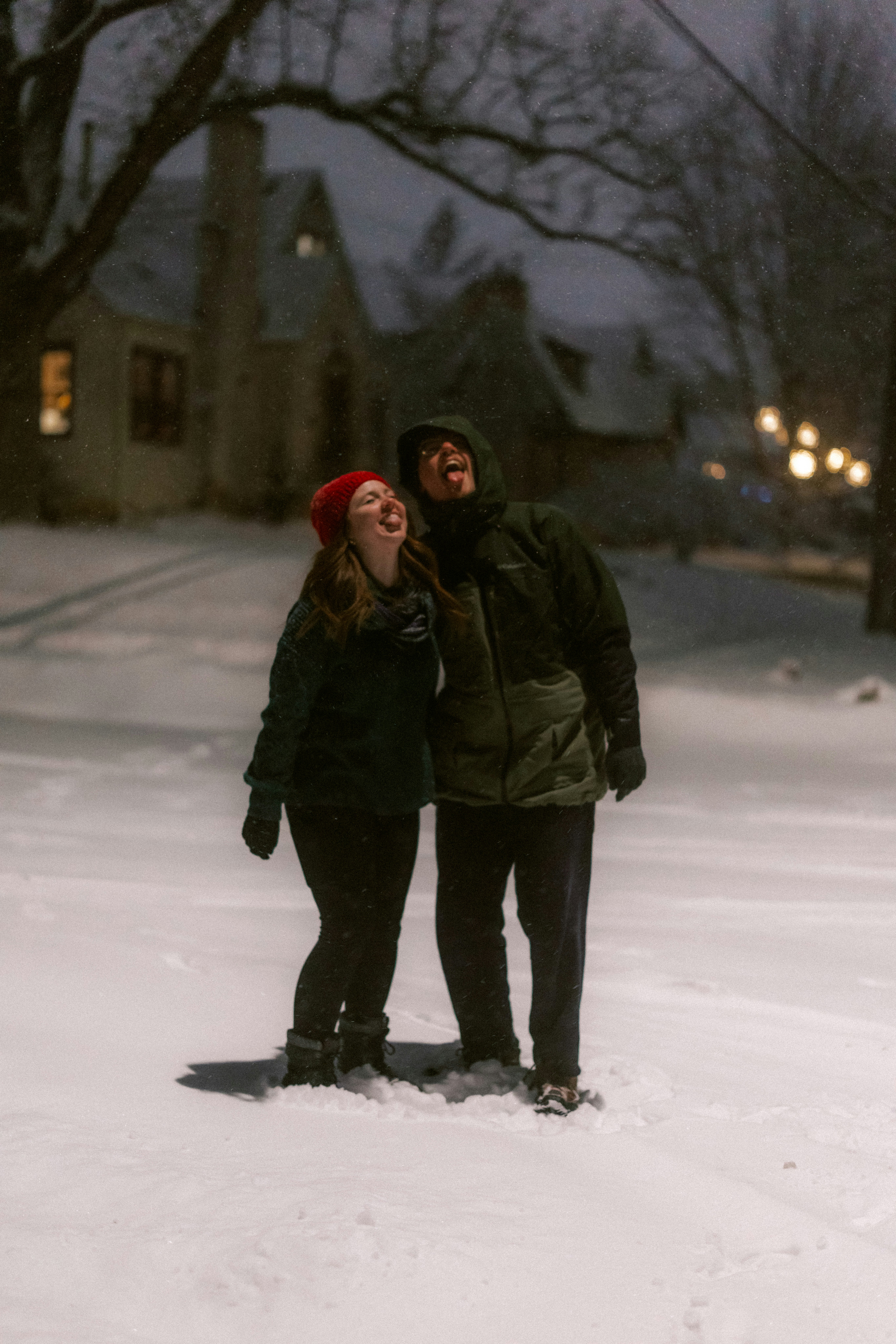 Snowy Night Laugh: Two Friends in Winter Light