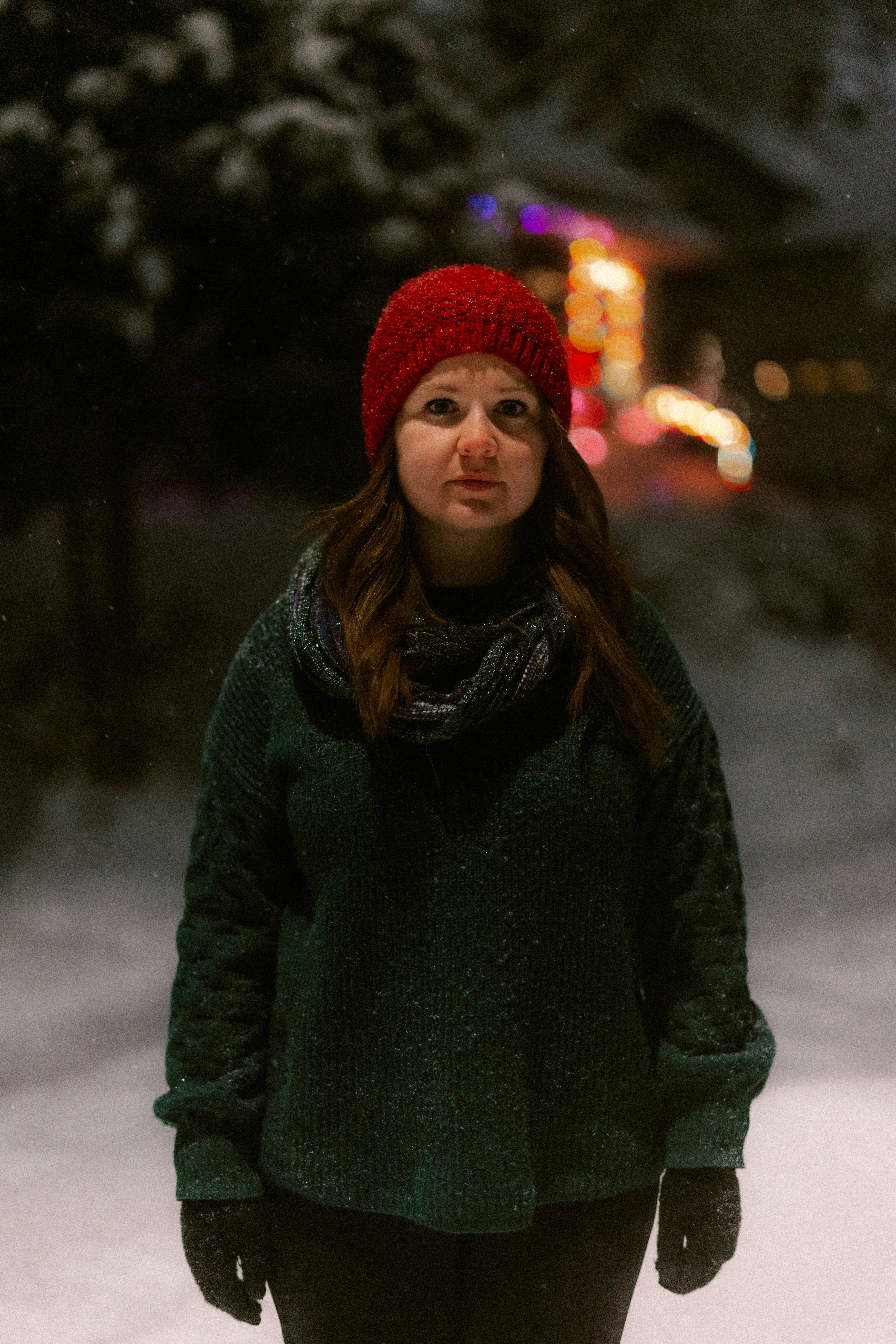 Red‑Hatted Portrait in a Snowy Night