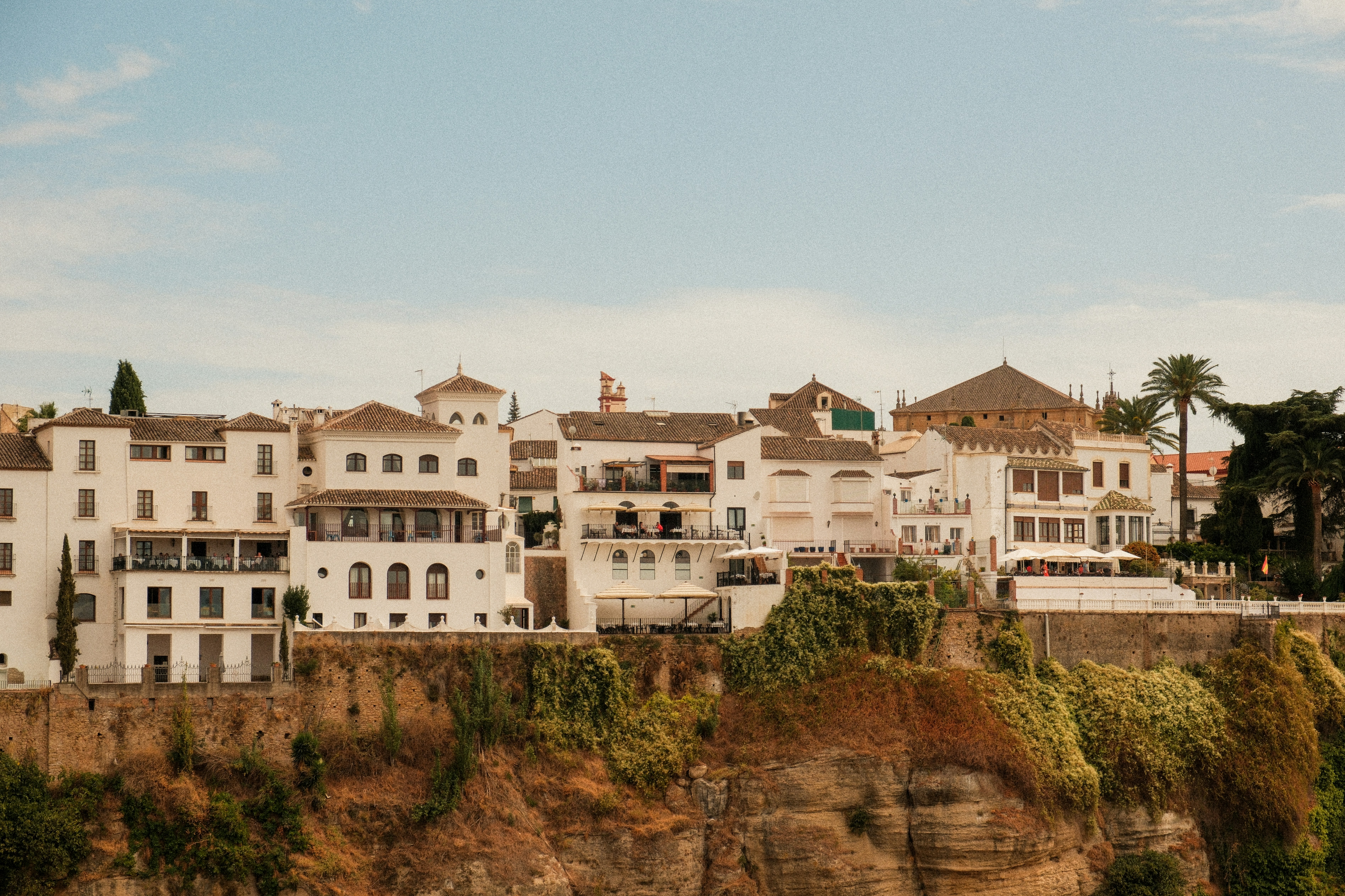 Cliffside Whitewashed Village Nestled Above Verdant Drops