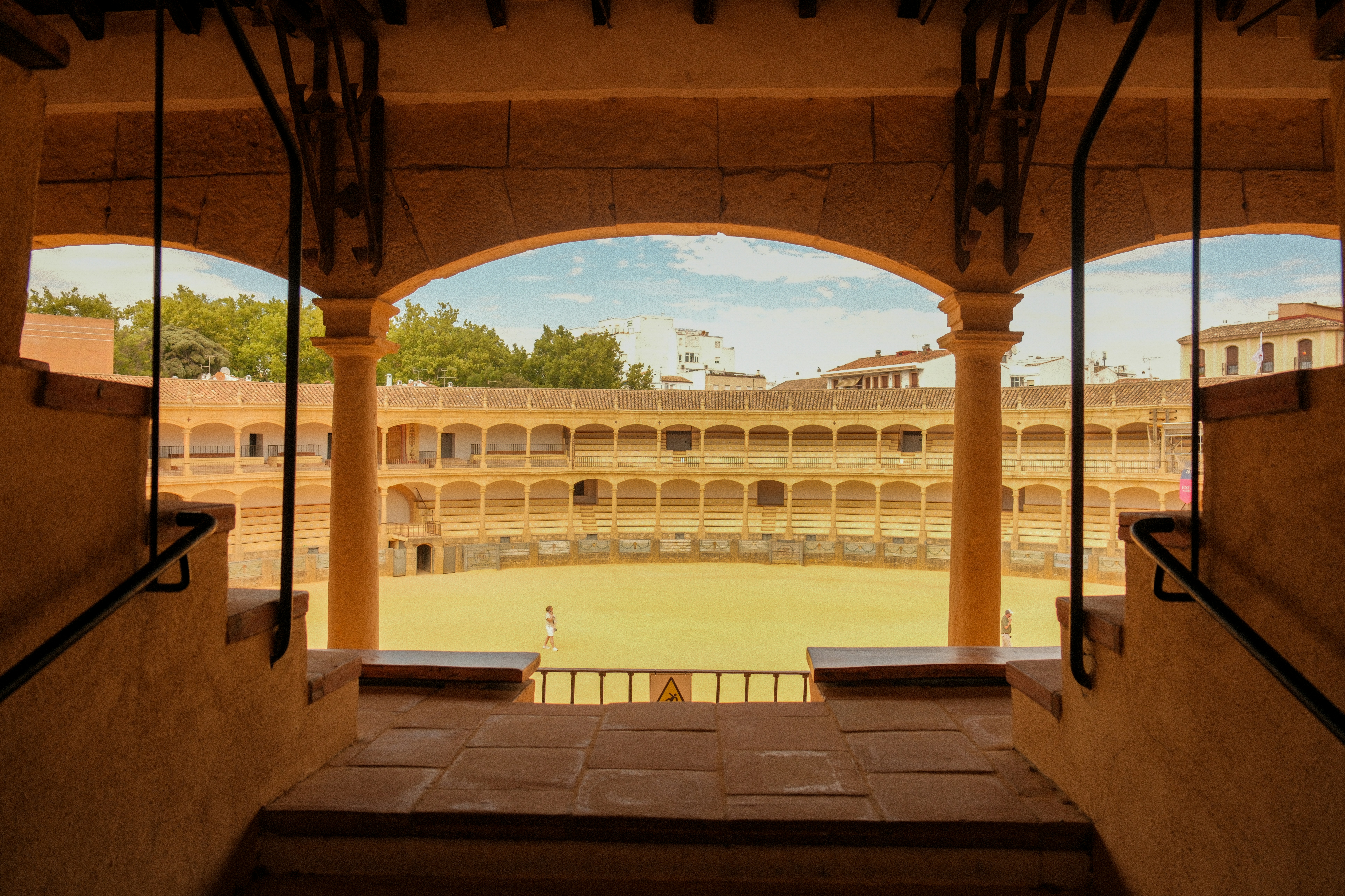 Symmetrical Courtyard Through Stone Archways