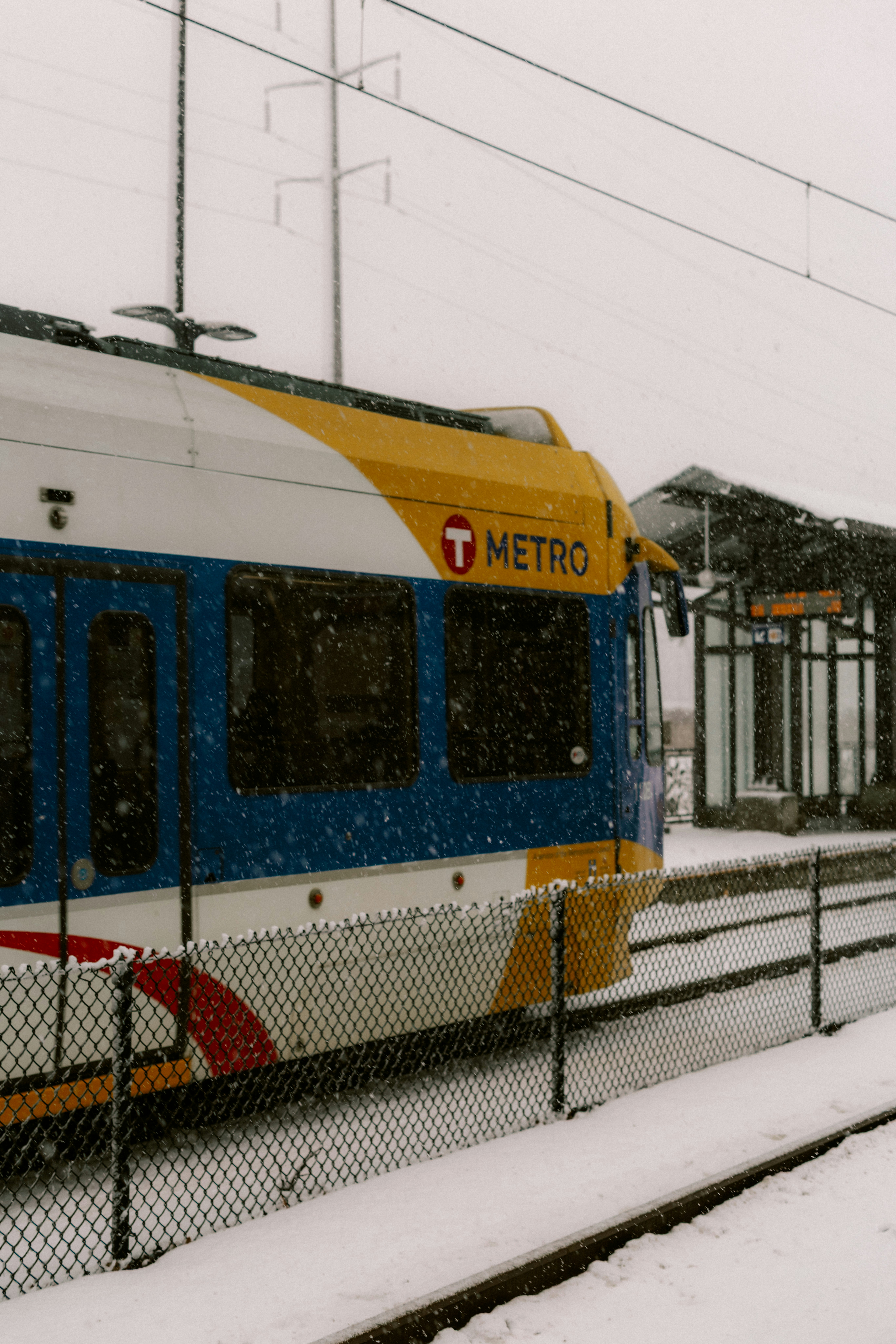 Snowy Metro Stop: A Trainside Moment in Quiet Winter Light