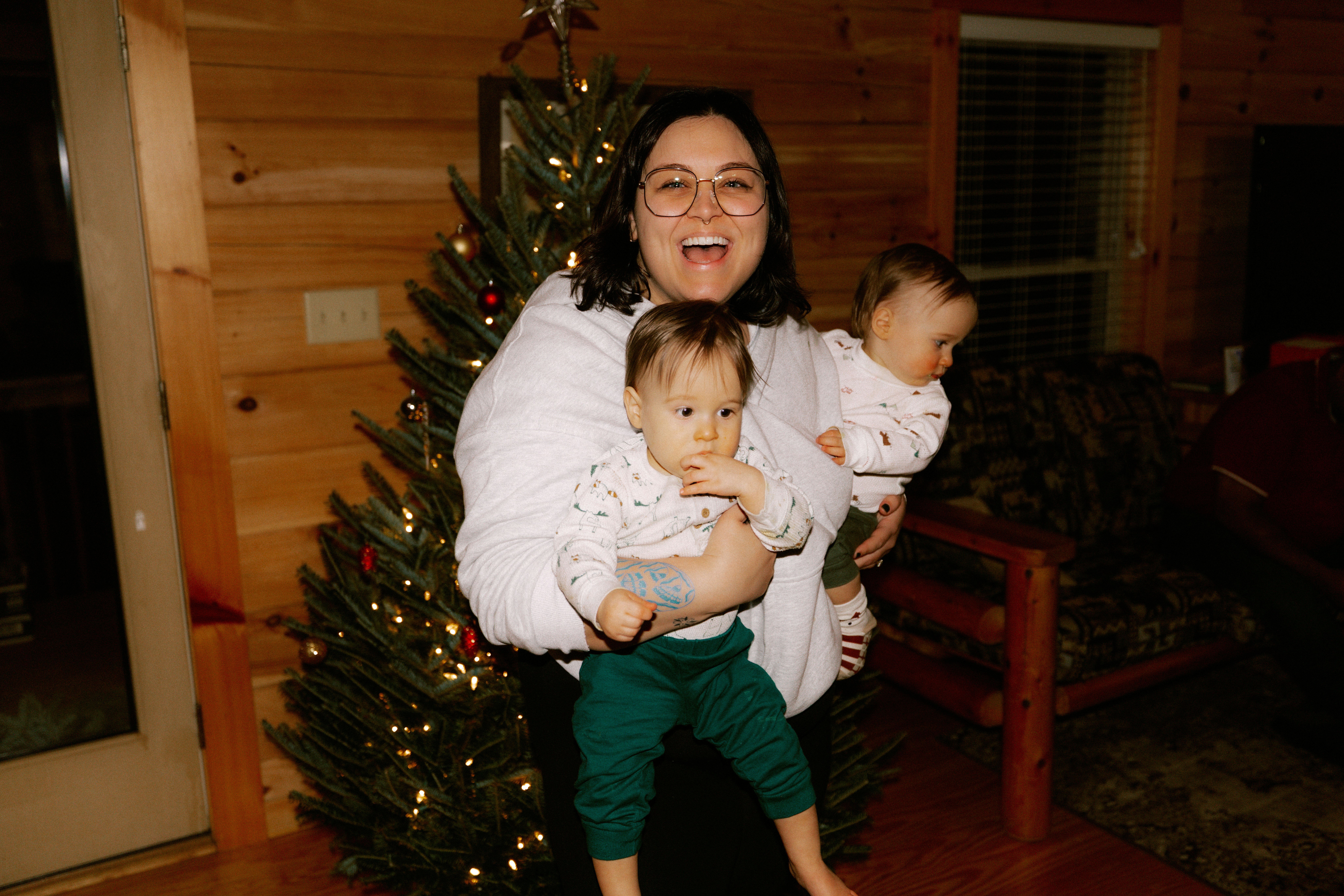 Joy by the Christmas Tree: Family Portrait in Warm Wood Kitchen