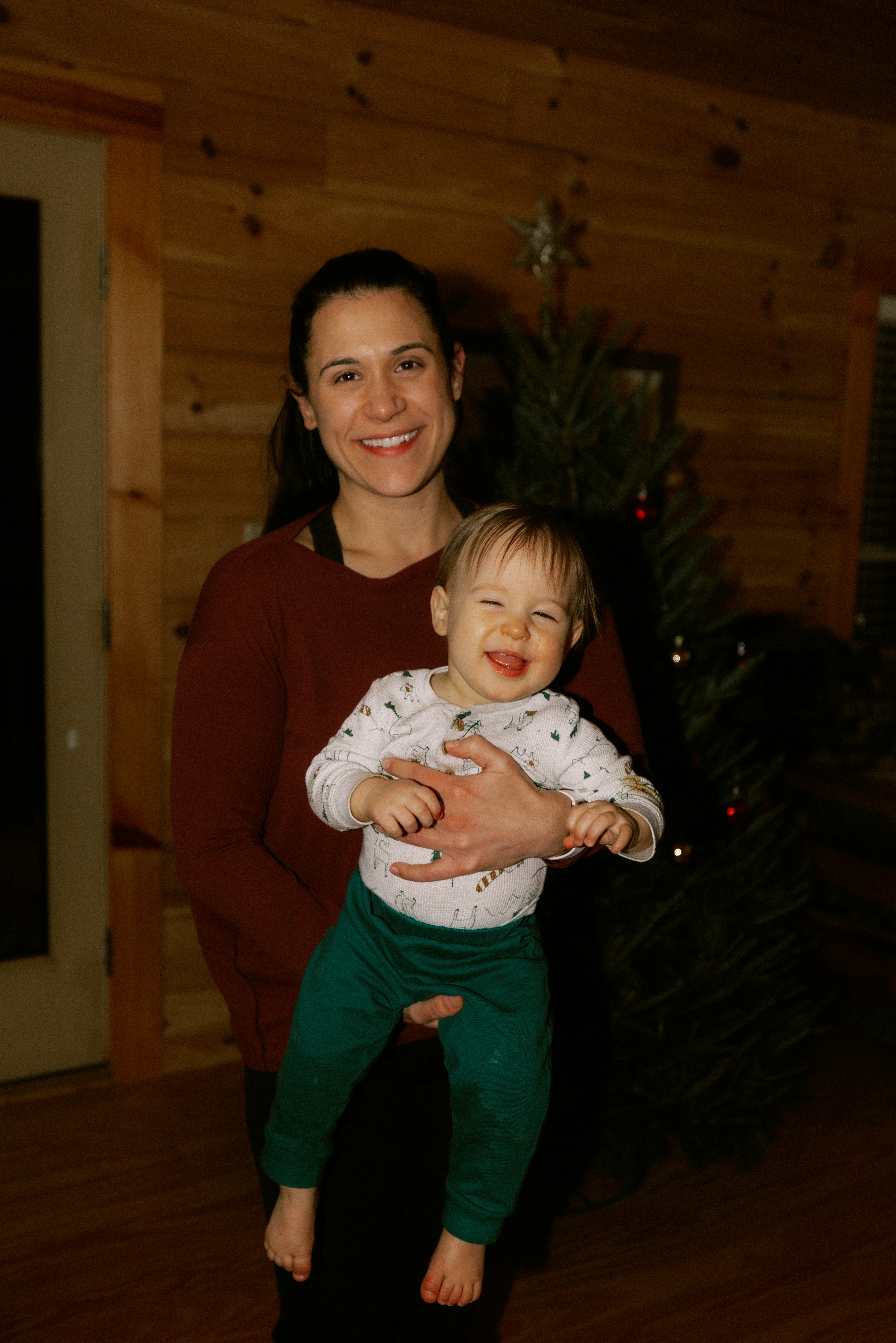 Joyful Mother and Baby Holding On to Christmas Cheer