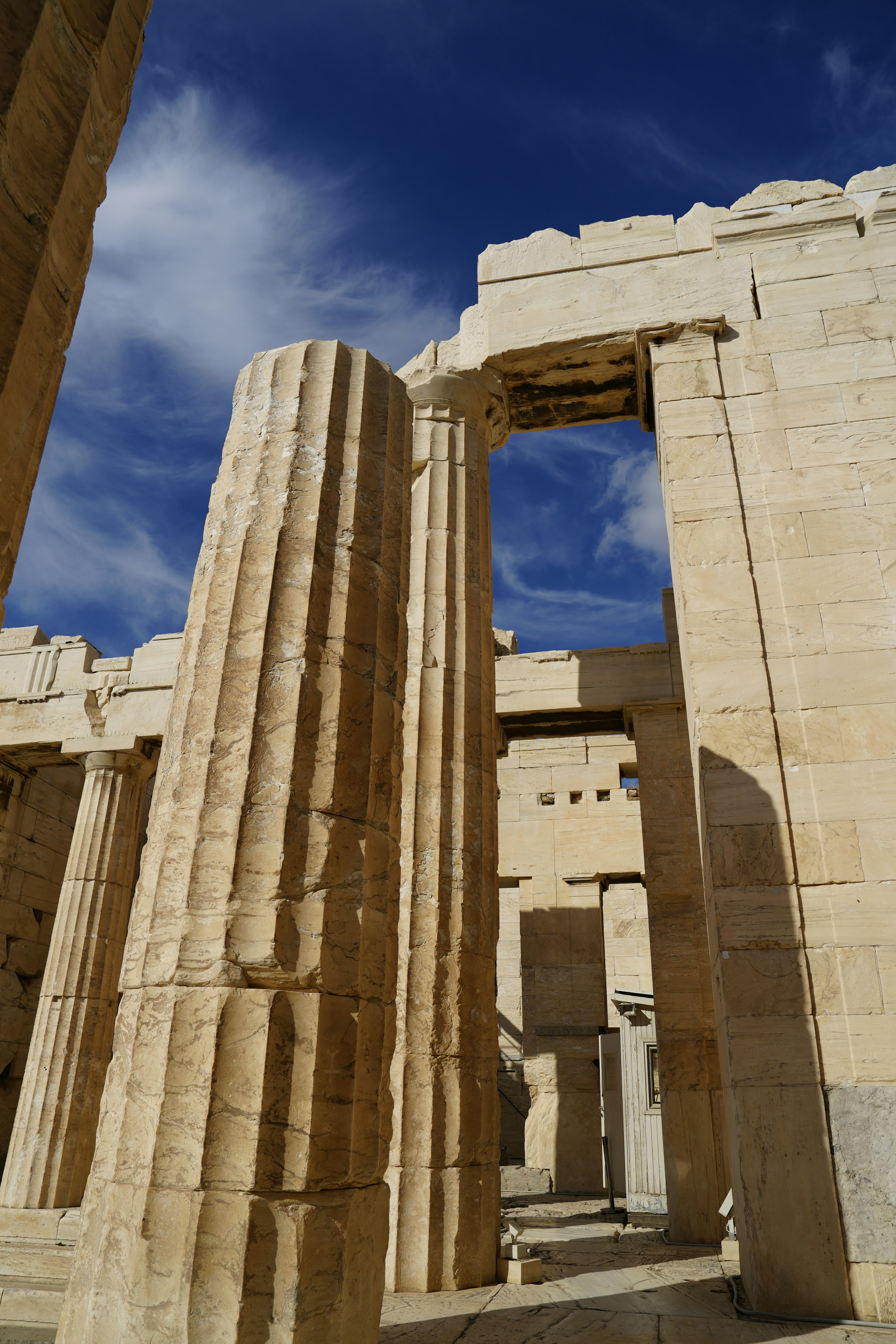 Stone Columns Rise Toward a Clear Sky at Ancient Ruins