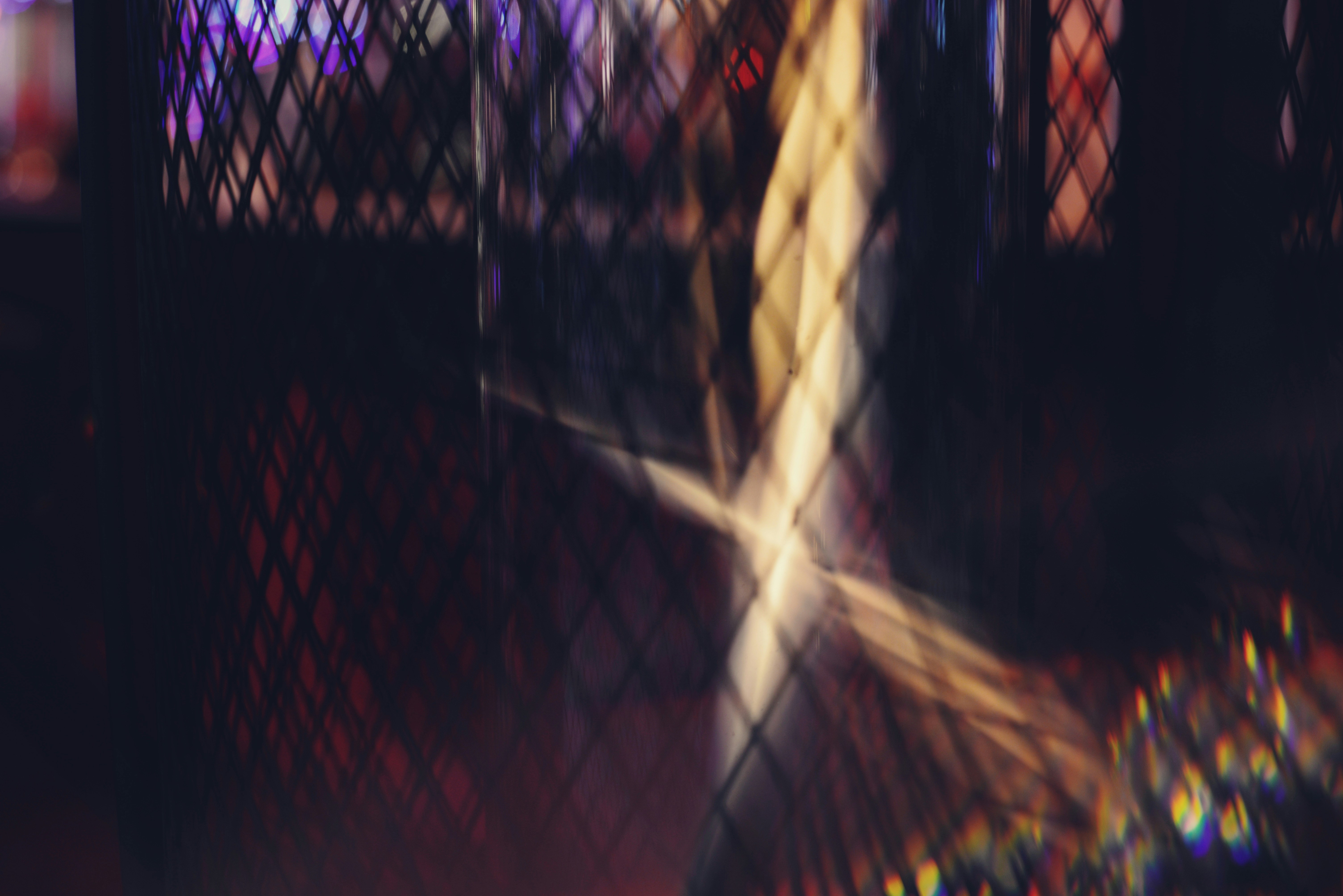 Crisscrossed Neon Mesh Through a Velvet Night
