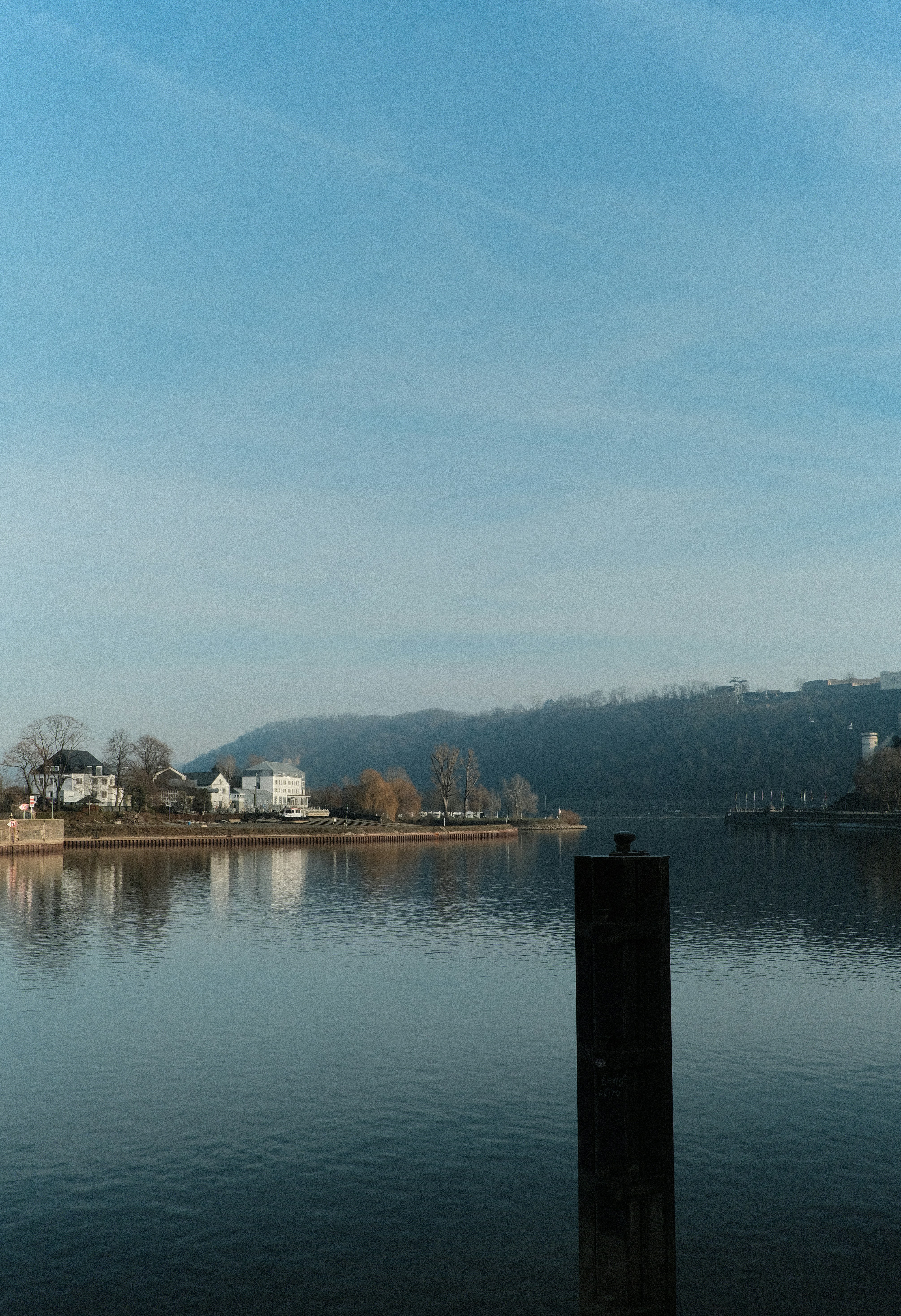 Silhouetted Piling in a Tranquil Waterfront Landscape