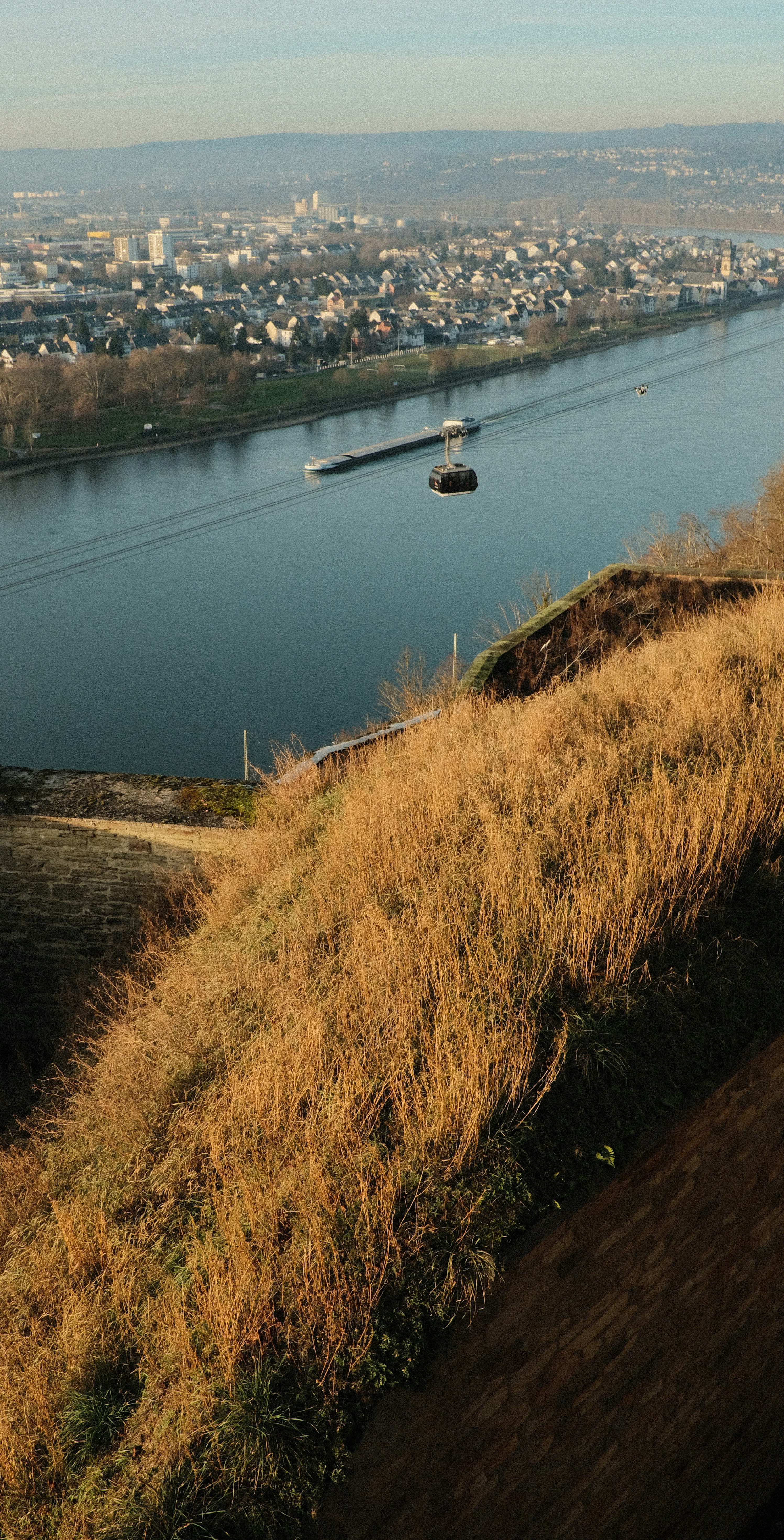 Ridgetop View: Cable Car Gliding Across a River Valley