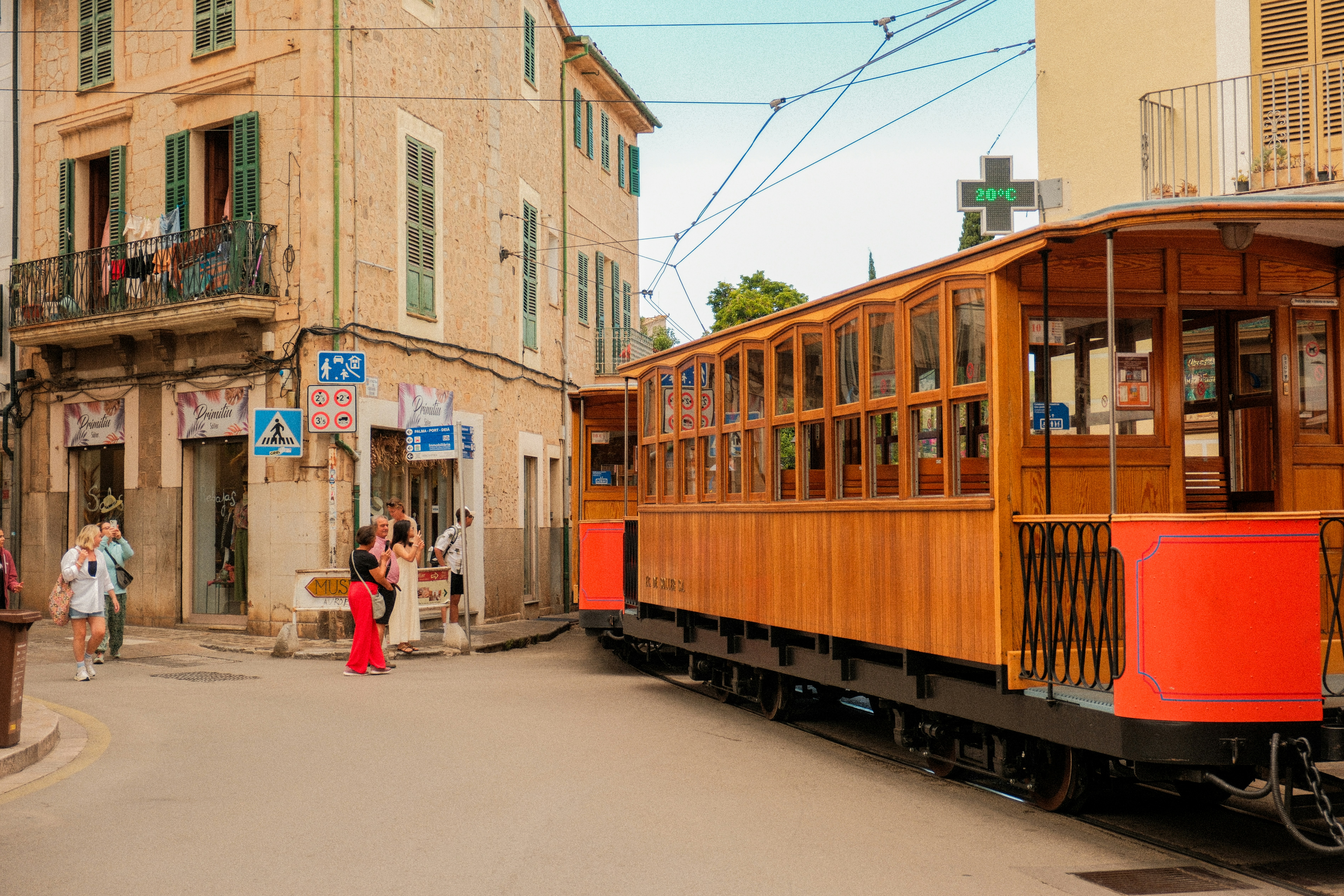 Sunlit Tram on a Quiet Mediterranean Street