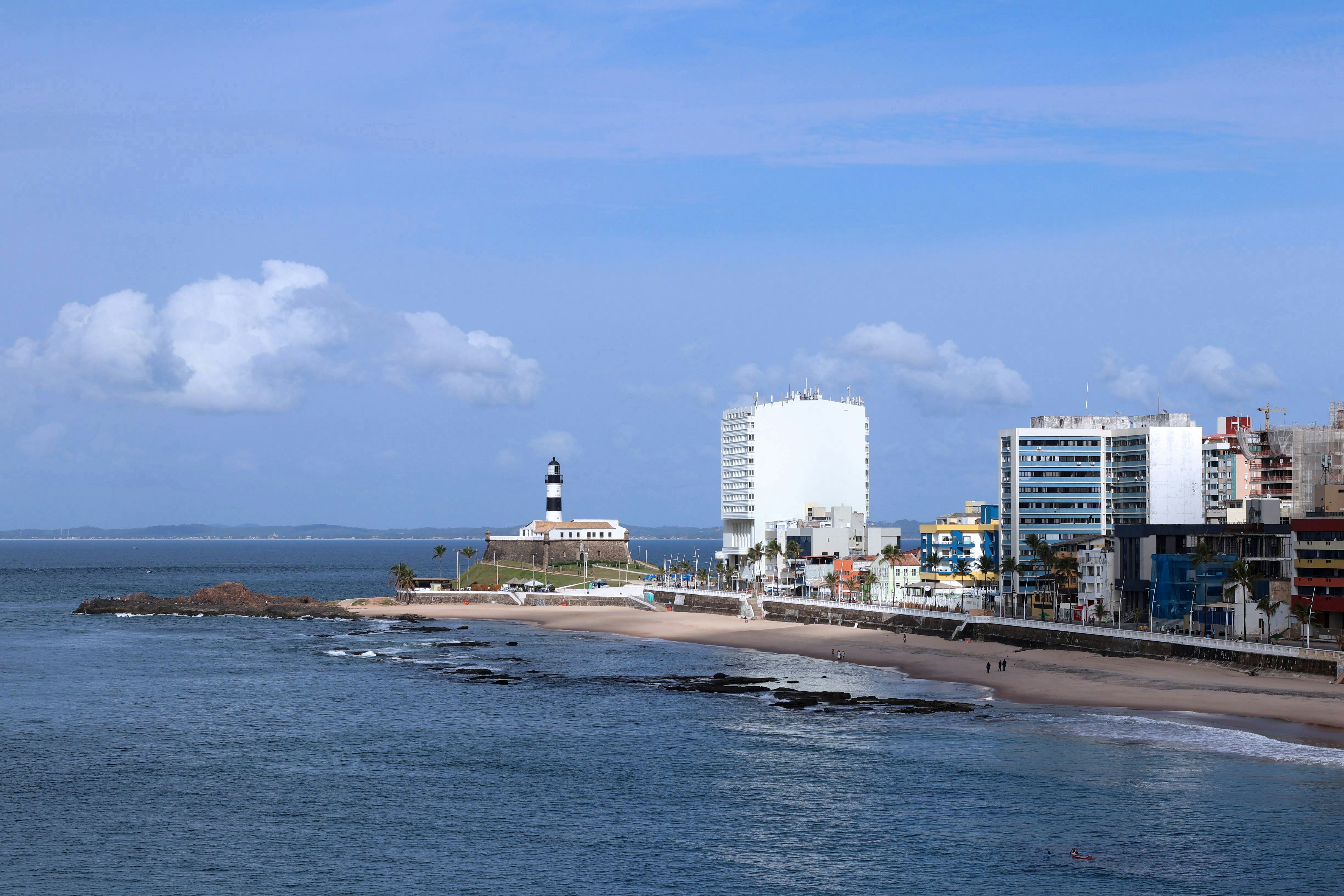 Coastal Boulevard with Lighthouse and Modern Waterfront