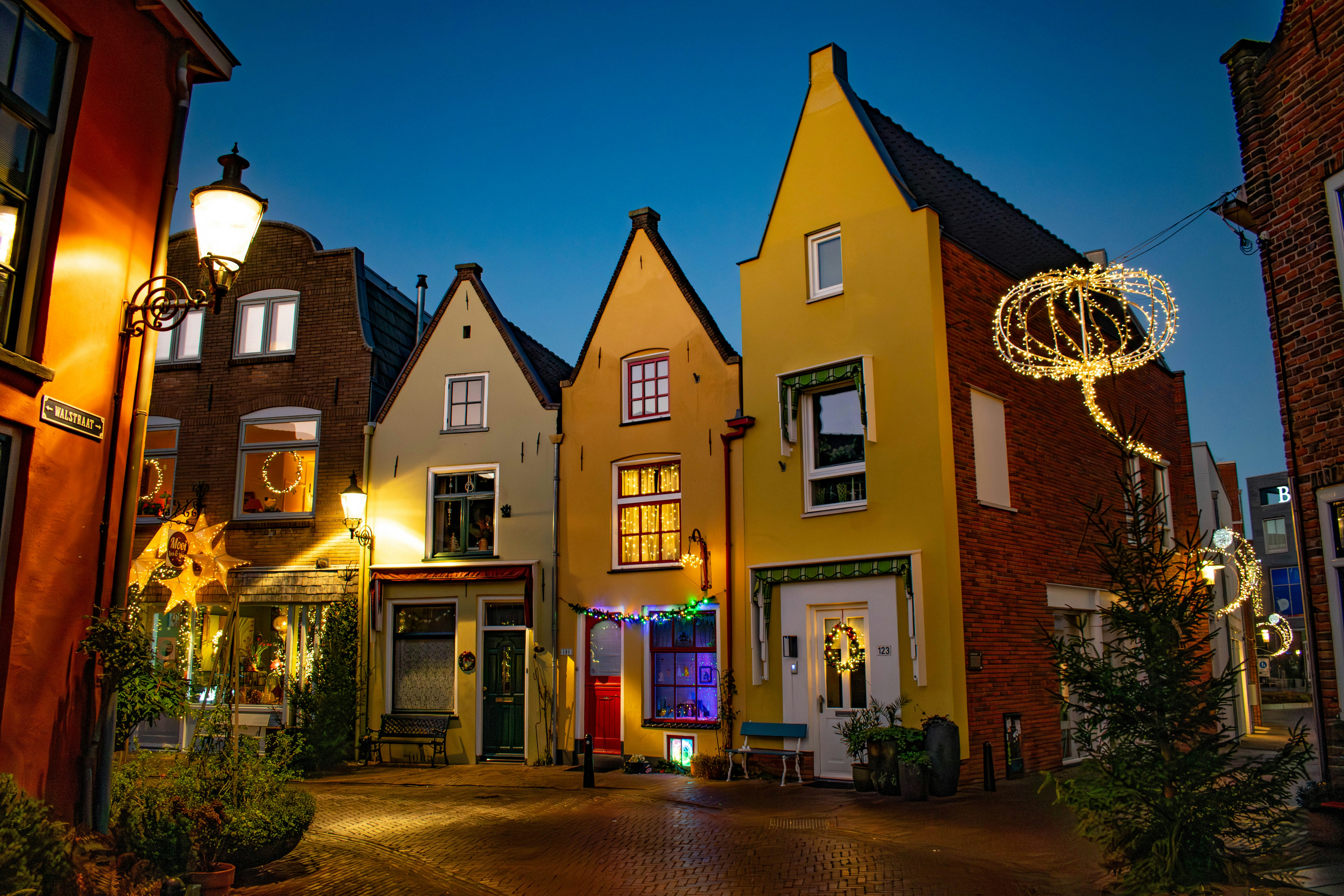 Luminous Lane: A quiet Christmas street anchored by sunlit houses
