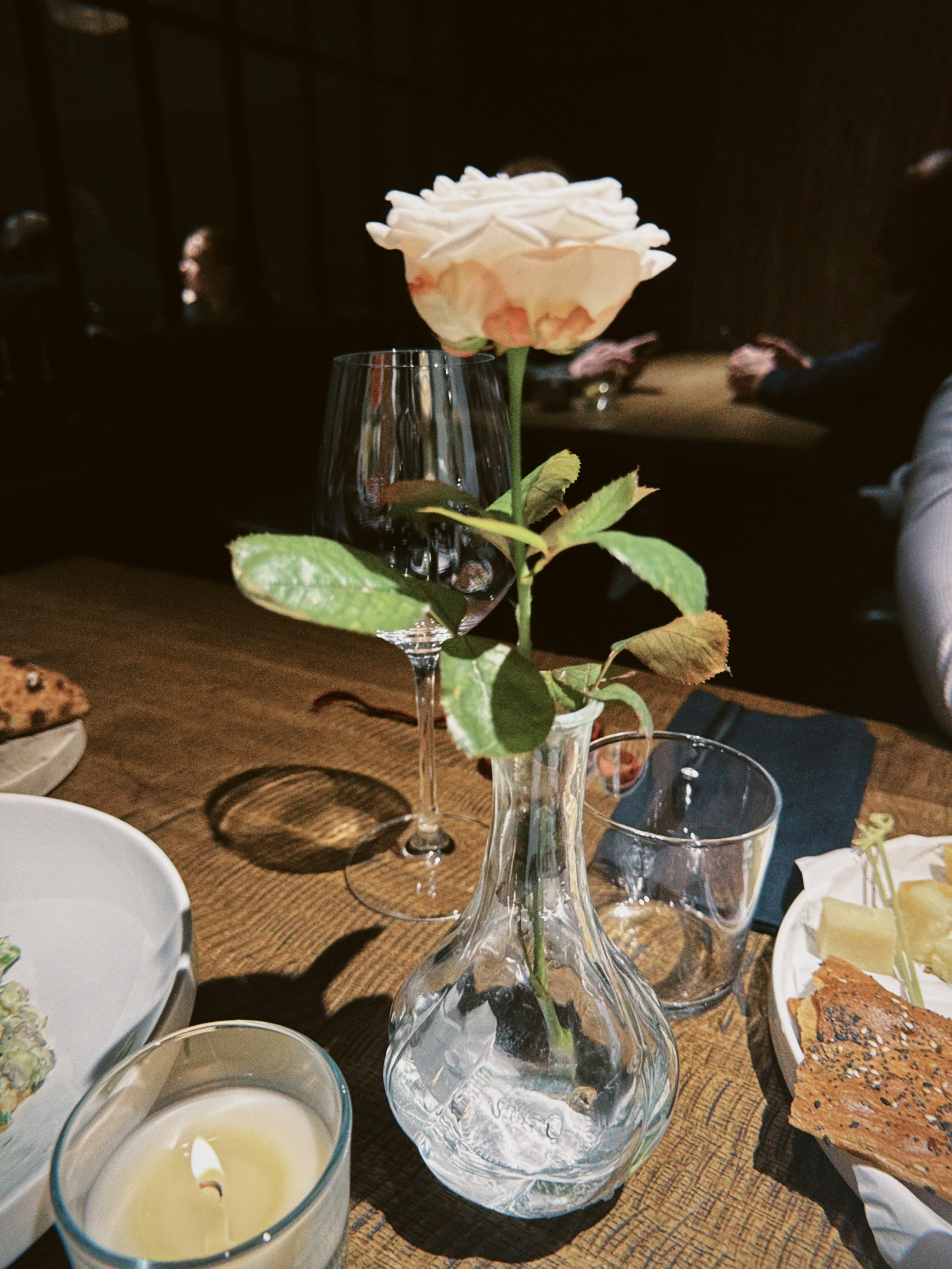 Rose in a Glass: A Quiet Center of Light at Table