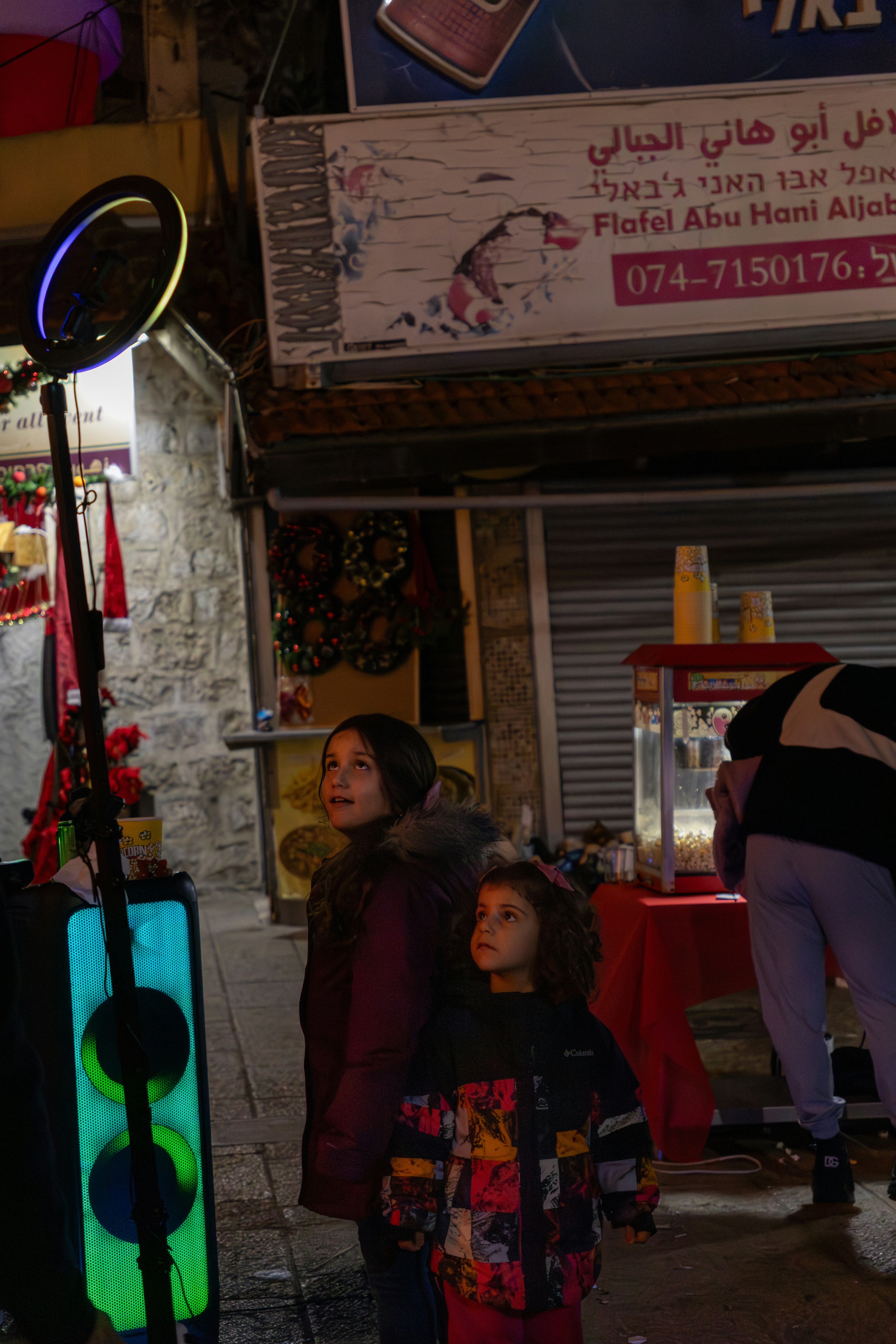 Night Market Portrait: Curious Gaze Under Neon Glow