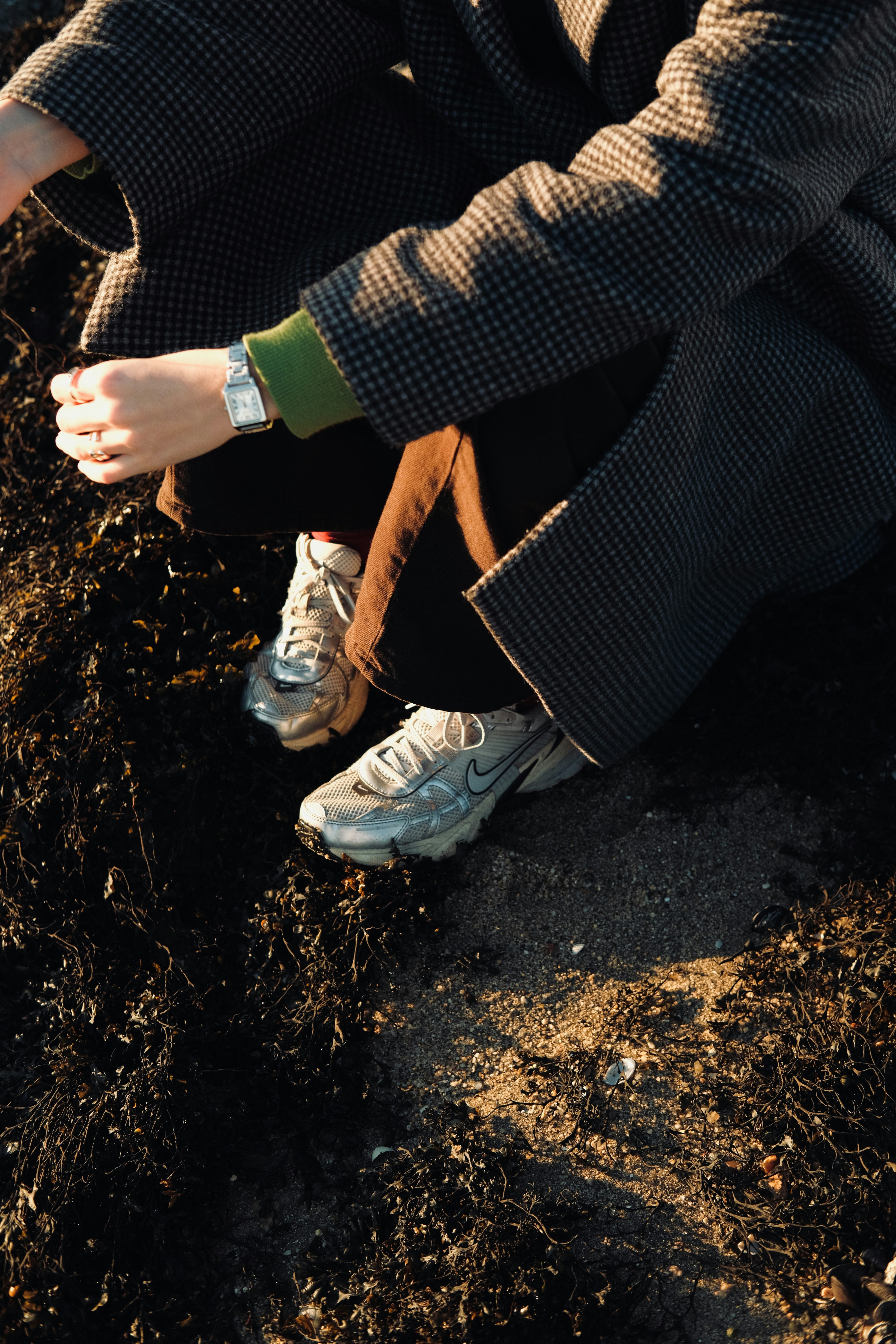 Grounded Confidence: Sneakers, Coat, and Quiet Sunset