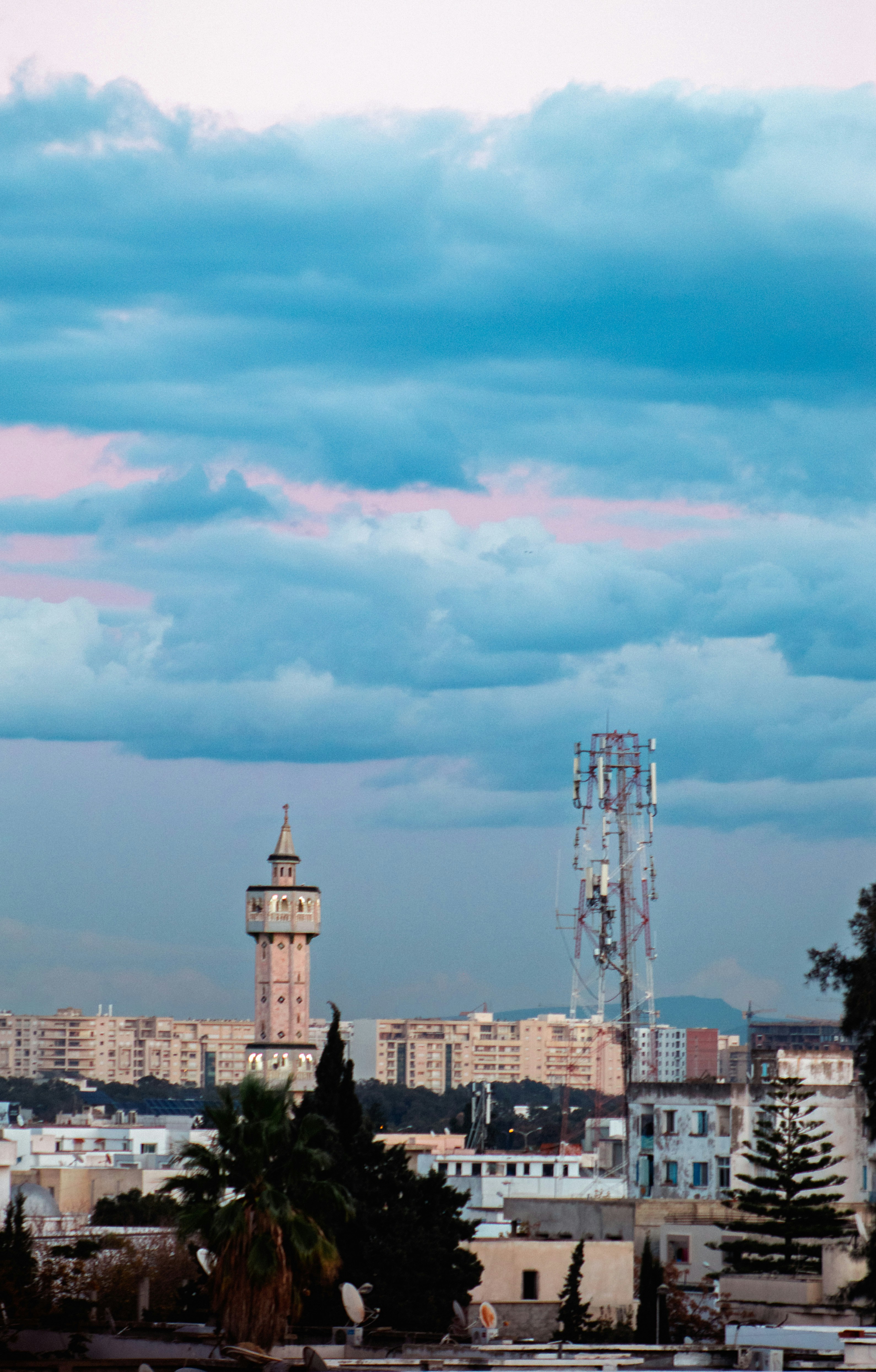 A Quiet City Skyline Under a Pastel Sky
