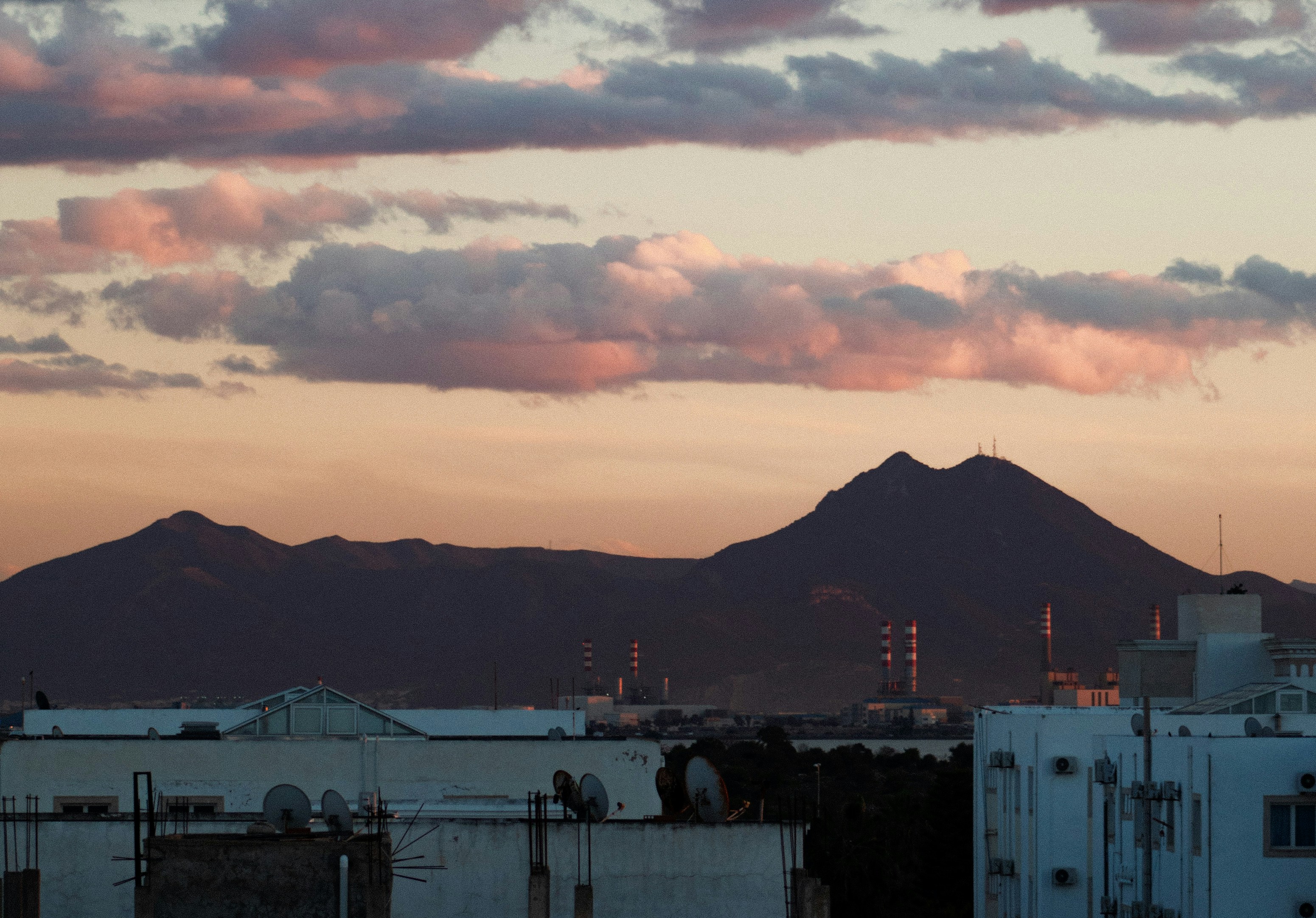 Sunset Silhouette over a Quiet Rooftop Horizon