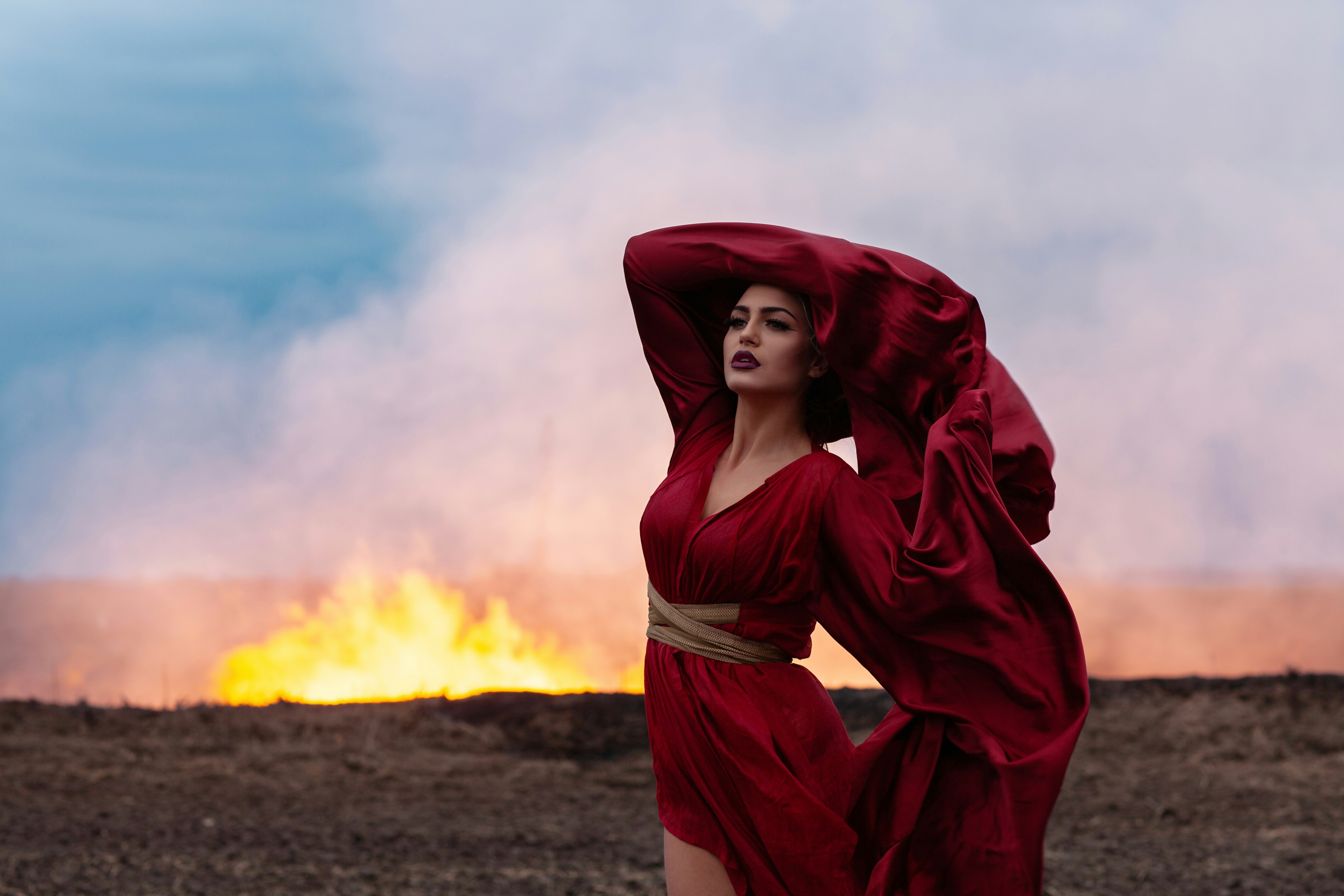 Scarlet veil against smoke and fire