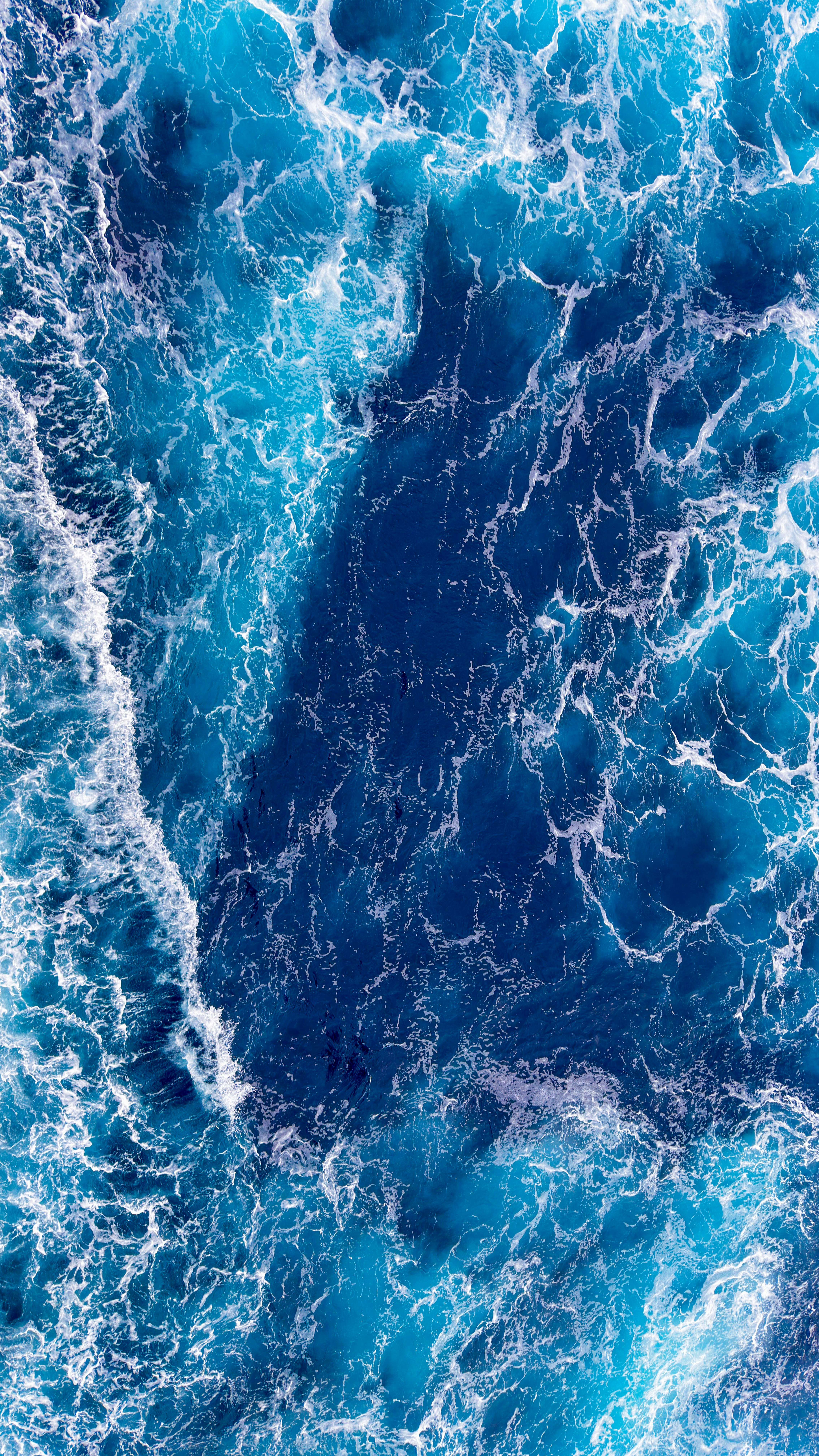 Abyssal Veins: A Drone-View of Turquoise Ocean Currents