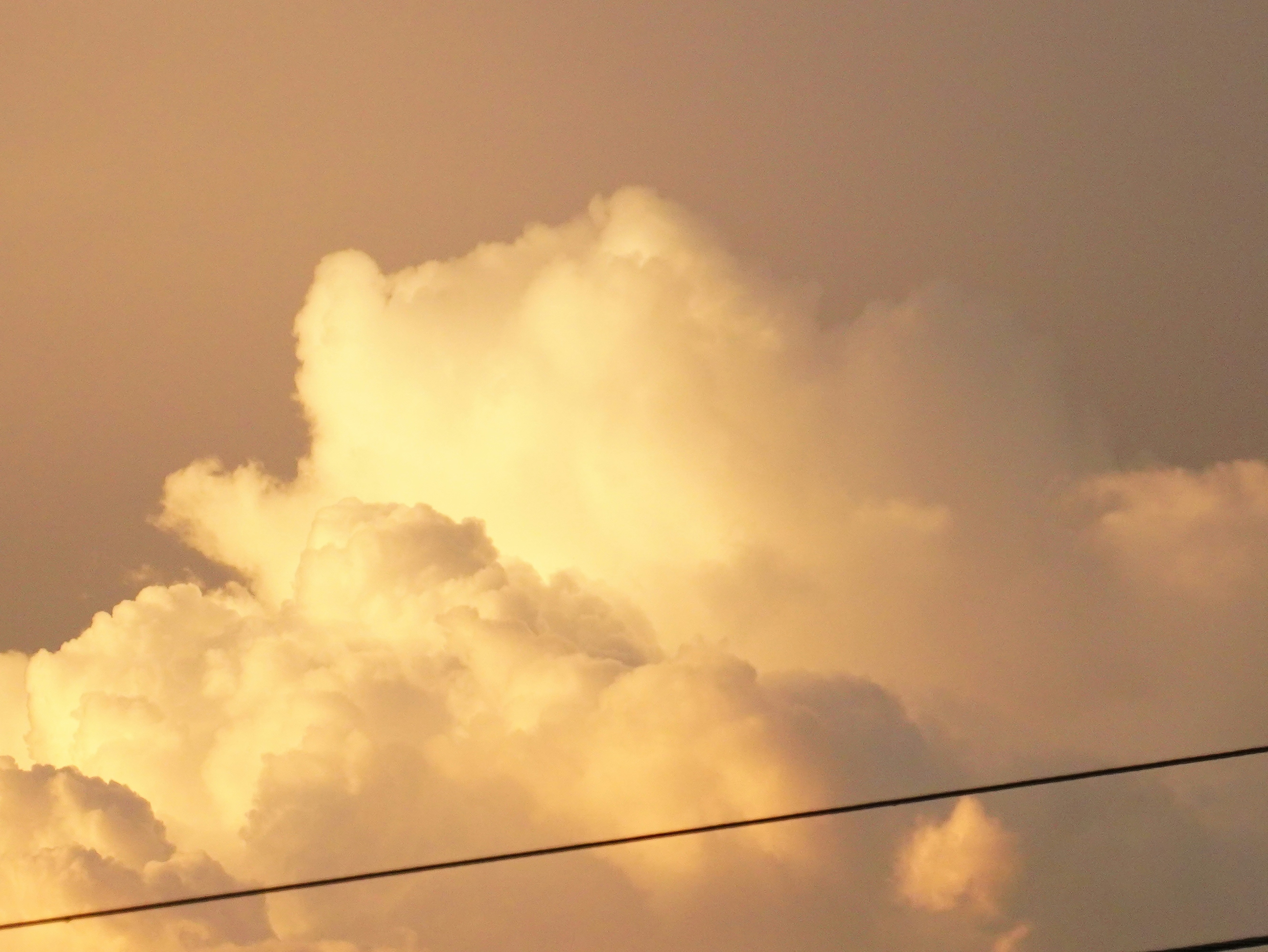 Golden Cloudstack at Dusk Over a Quiet Horizon