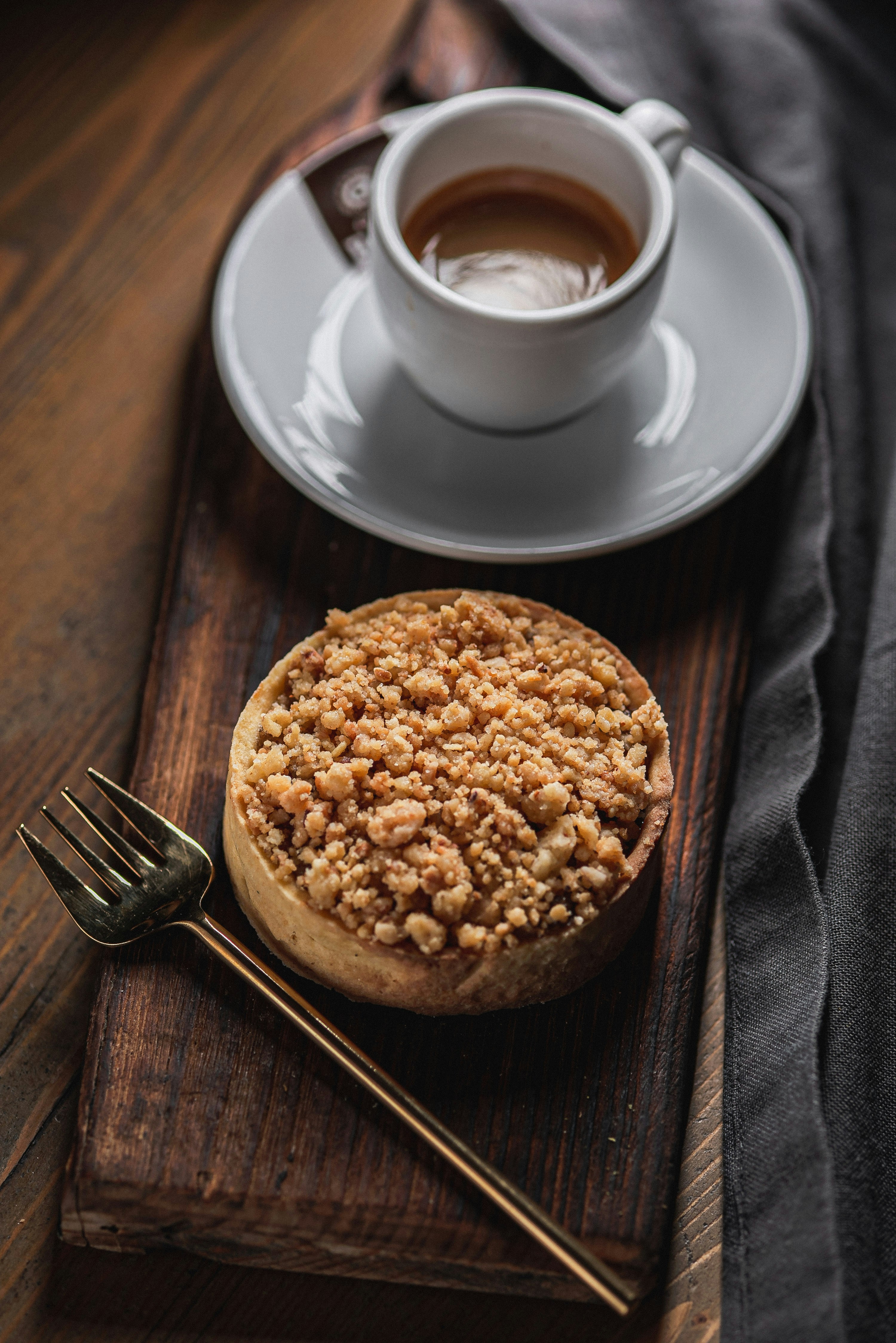 Creamy Espresso and Crumble: A Moment on a Wooden Stage
