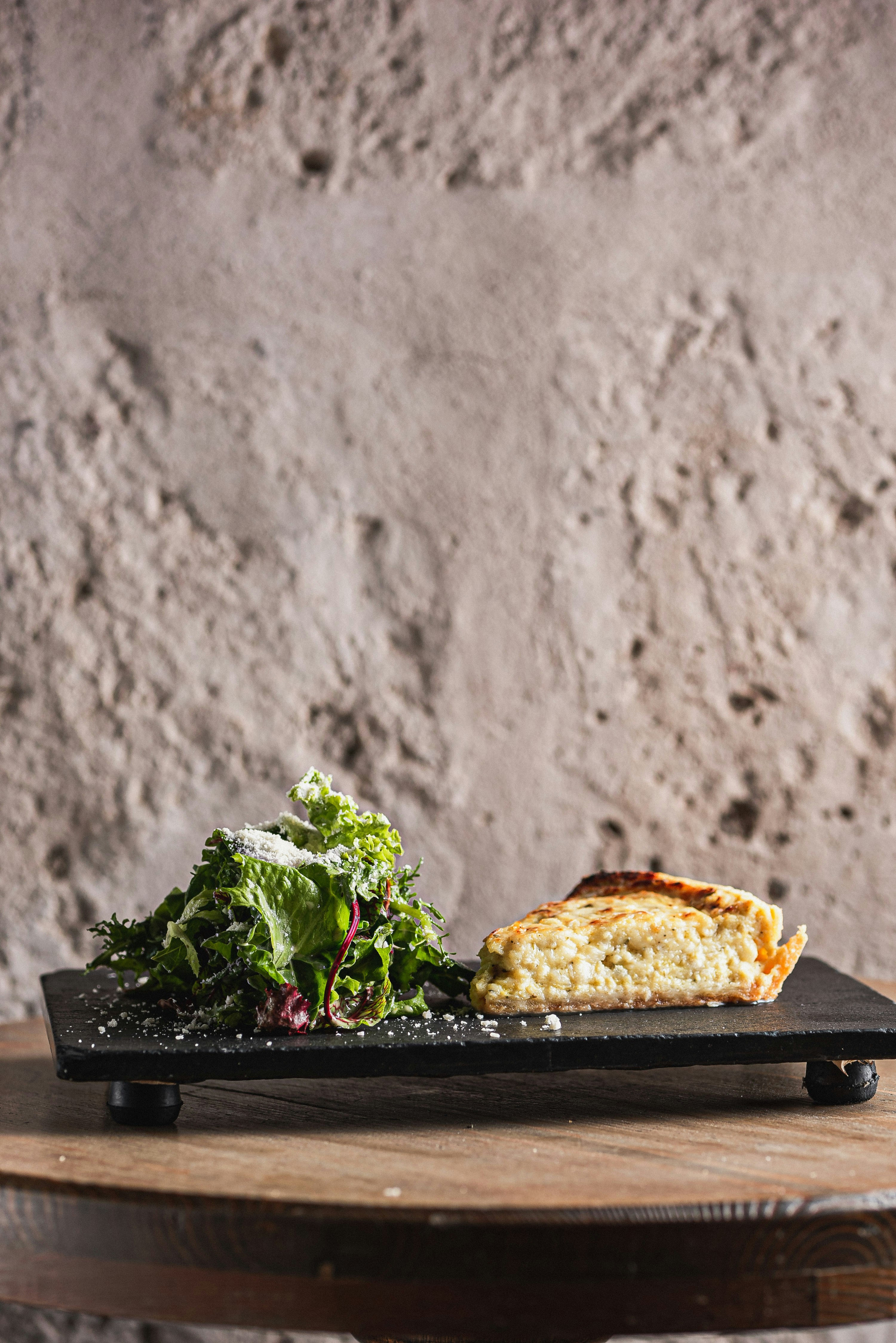 Savory Cheesecake and Greens on a Minimal Slate