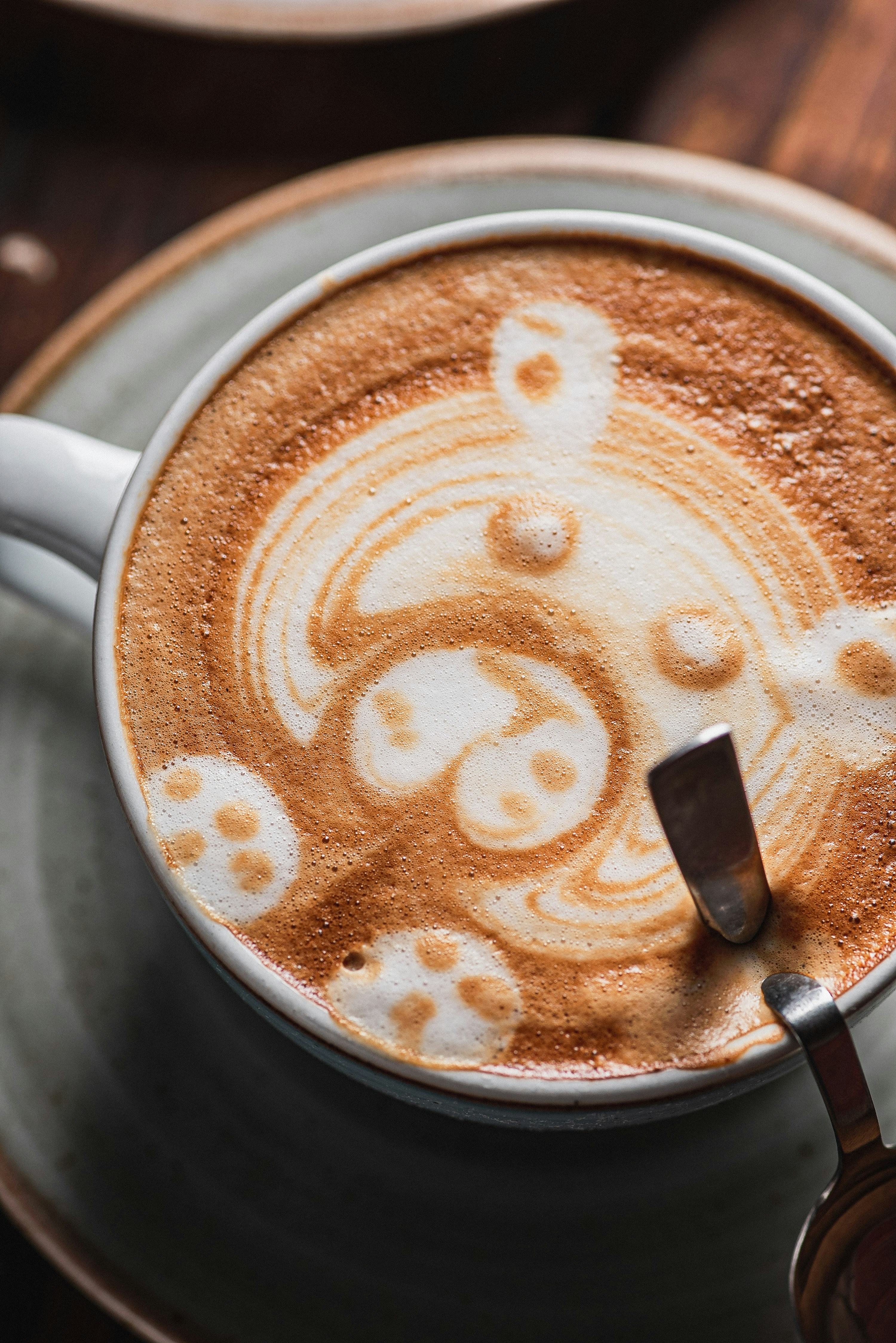 Latte Portrait: Swirls of Cinnamon Constellations on Foam